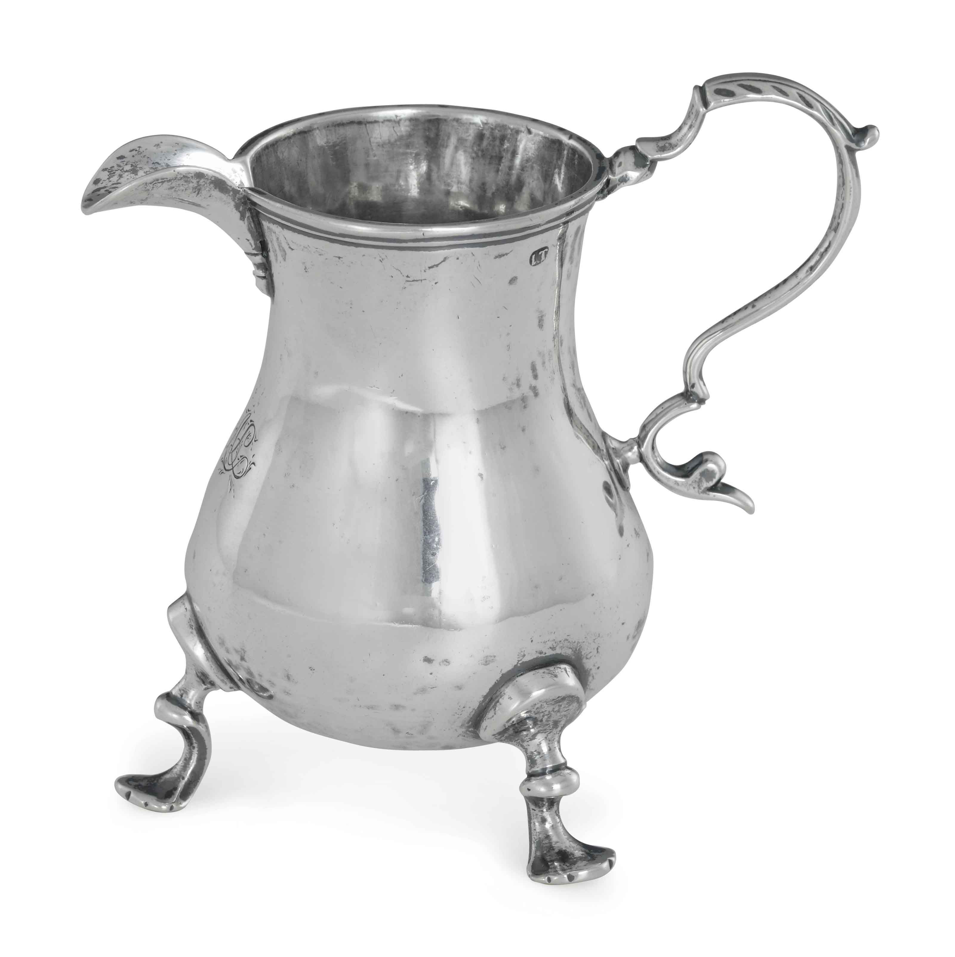 A SILVER CREAM POT