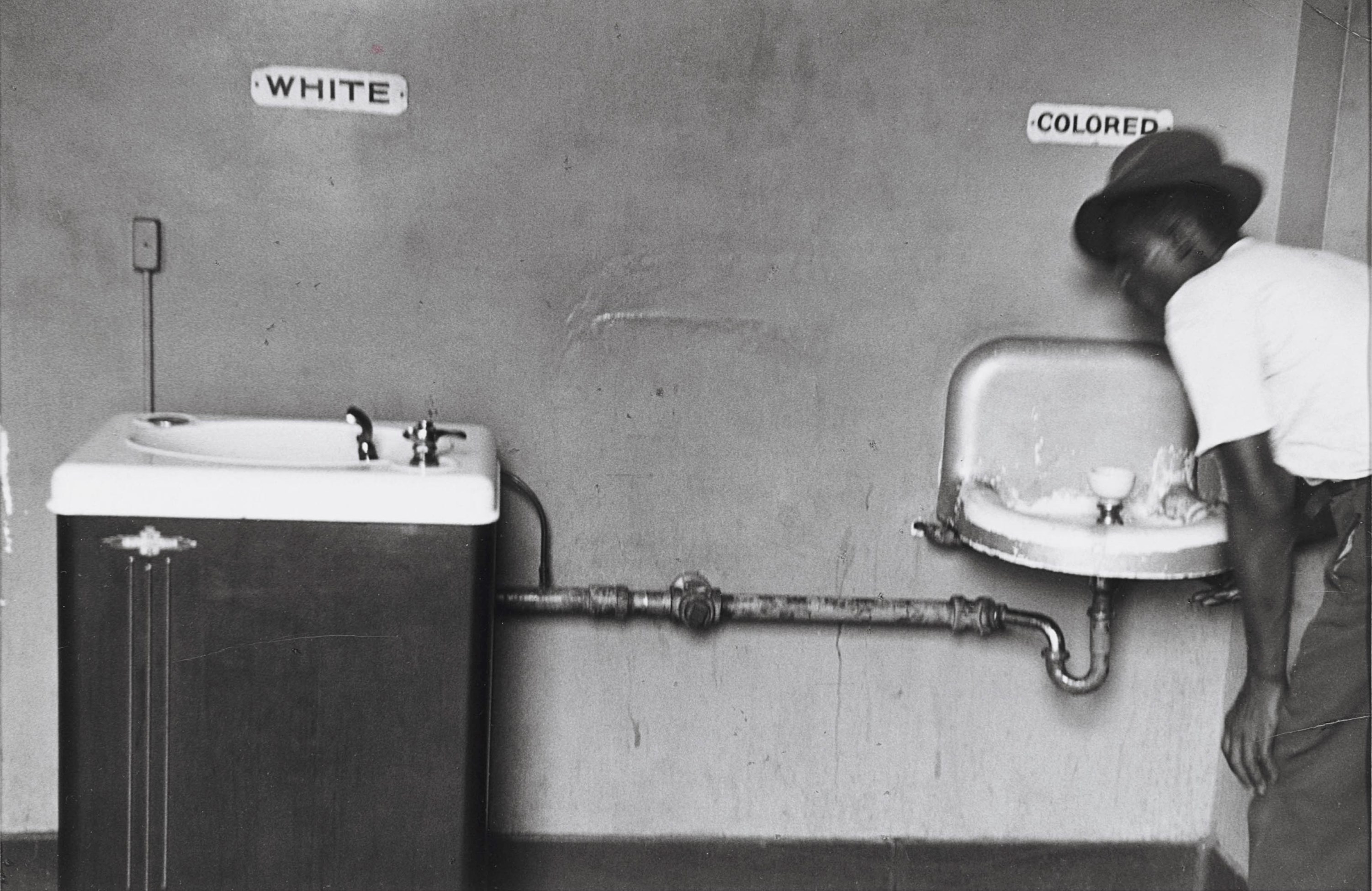 ELLIOTT ERWITT (B. 1928) , Segregated Water Fountains, North Carolina ...