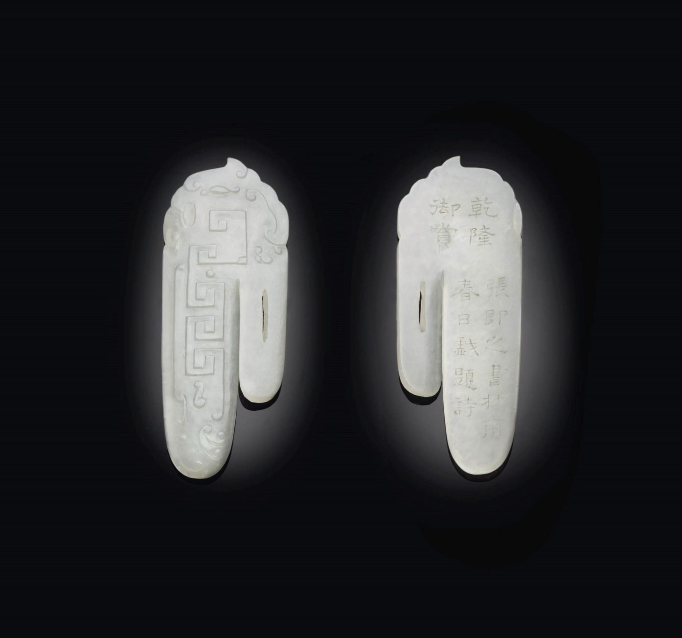 A RARE IMPERIAL INSCRIBED WHITE JADE SCROLL CLASP , QIANLONG YU SHANG ...