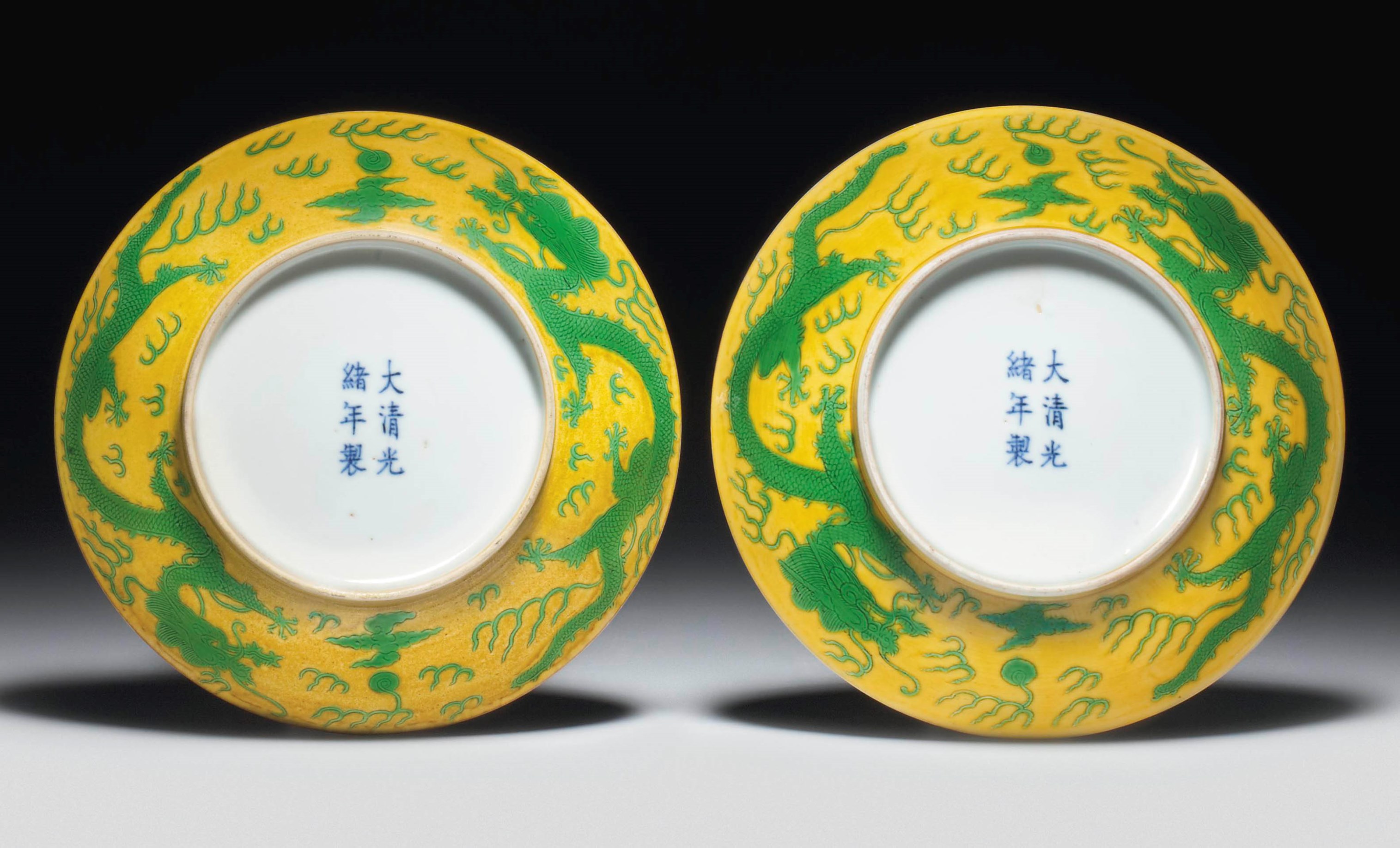 A PAIR OF GREEN AND YELLOW-GLAZED 'DRAGON' DISHES