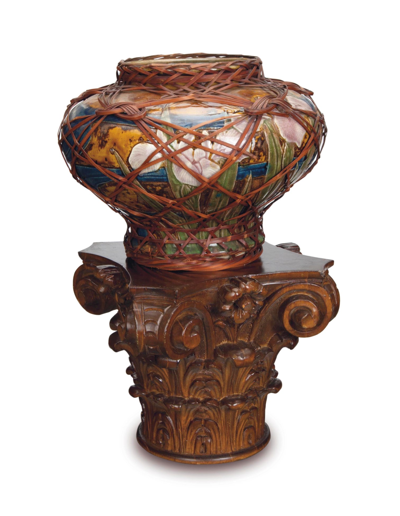 A RATTAN MOUNTED ARTS AND CRAFTS-STYLE VASE,