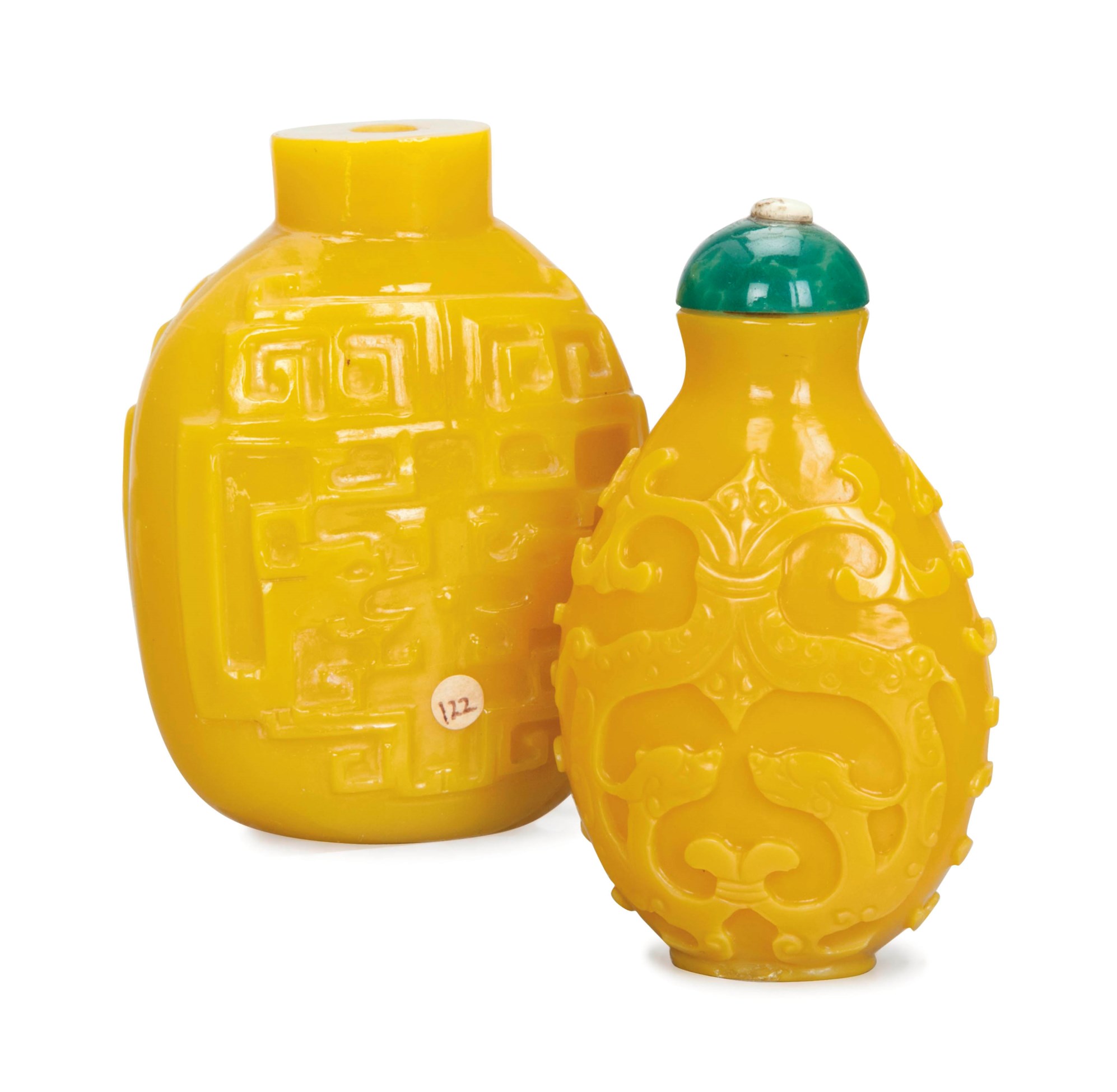 TWO CHINESE CARVED YELLOW SNUFF BOTTLES, | Christie's