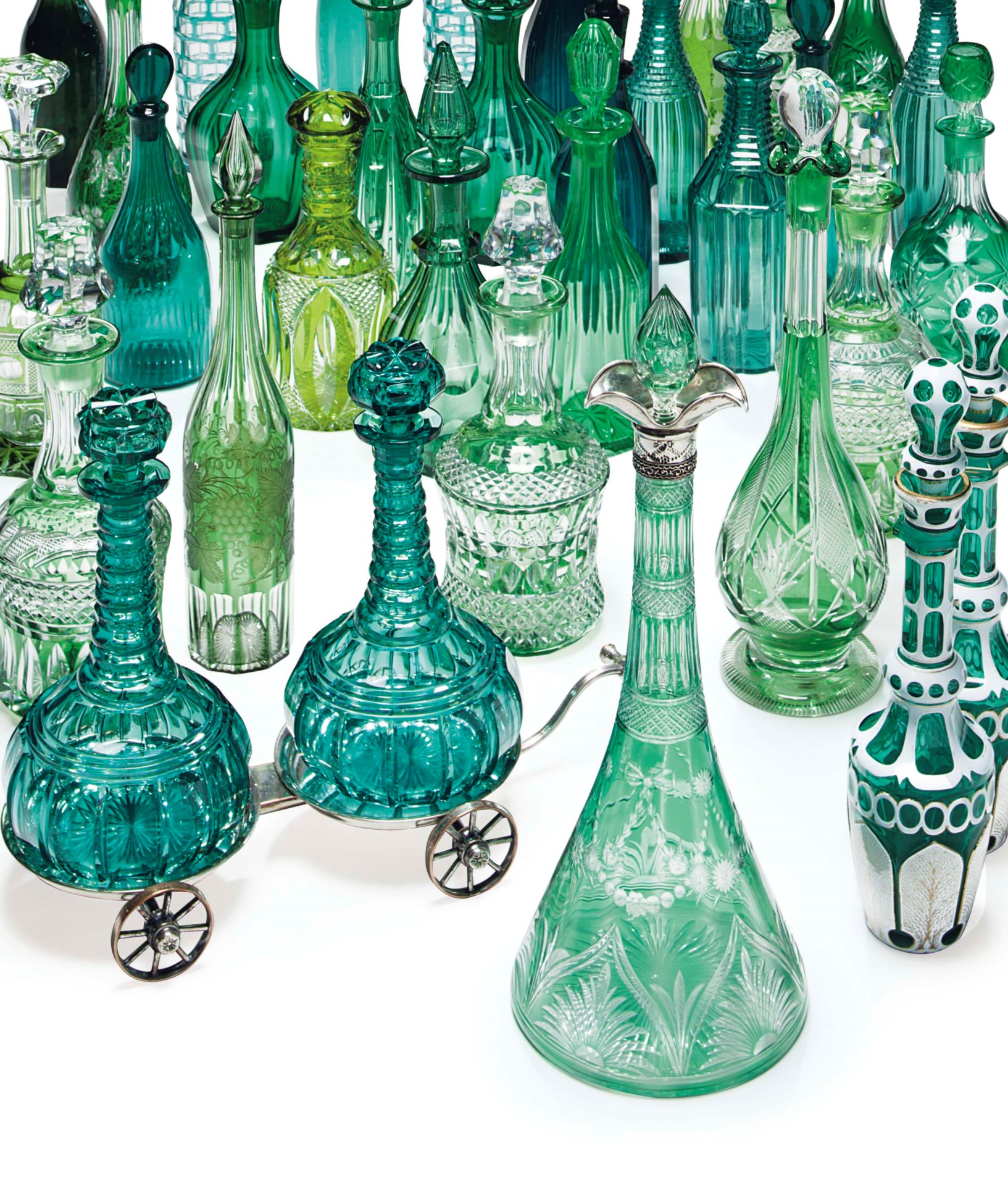 A COLLECTION OF TWENTY-THREE GREEN GLASS DECANTERS , 19TH/20TH CENTURY ...