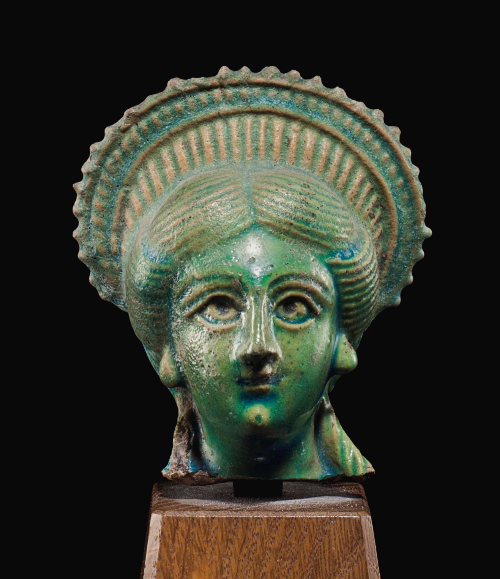 AN EGYPTIAN FAIENCE HEAD OF ISIS-APHRODITE , ROMAN PERIOD, CIRCA 1ST ...