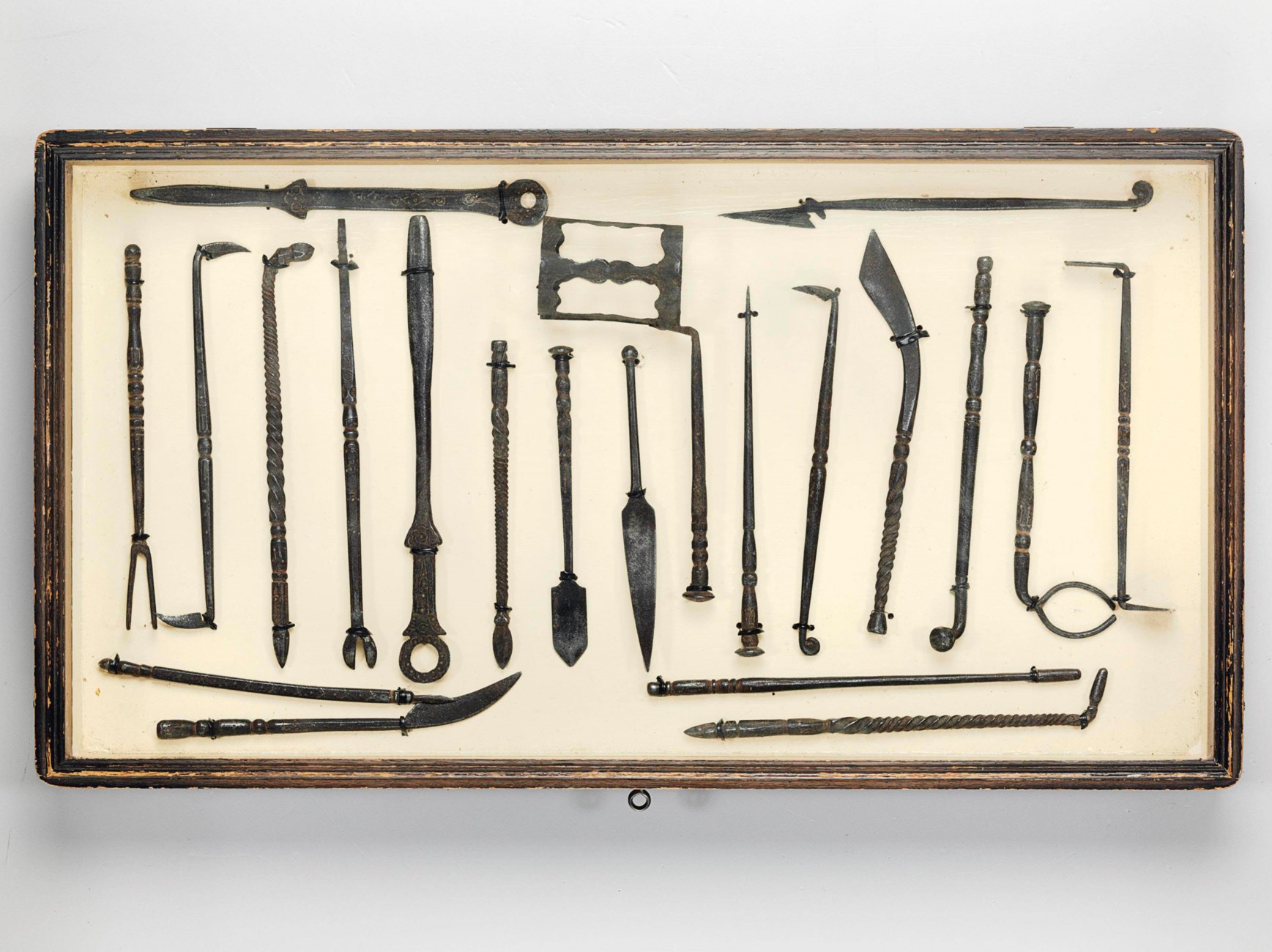 [SURGICAL INSTRUMENTS]. A group of 21 of finely grained wrought iron ...