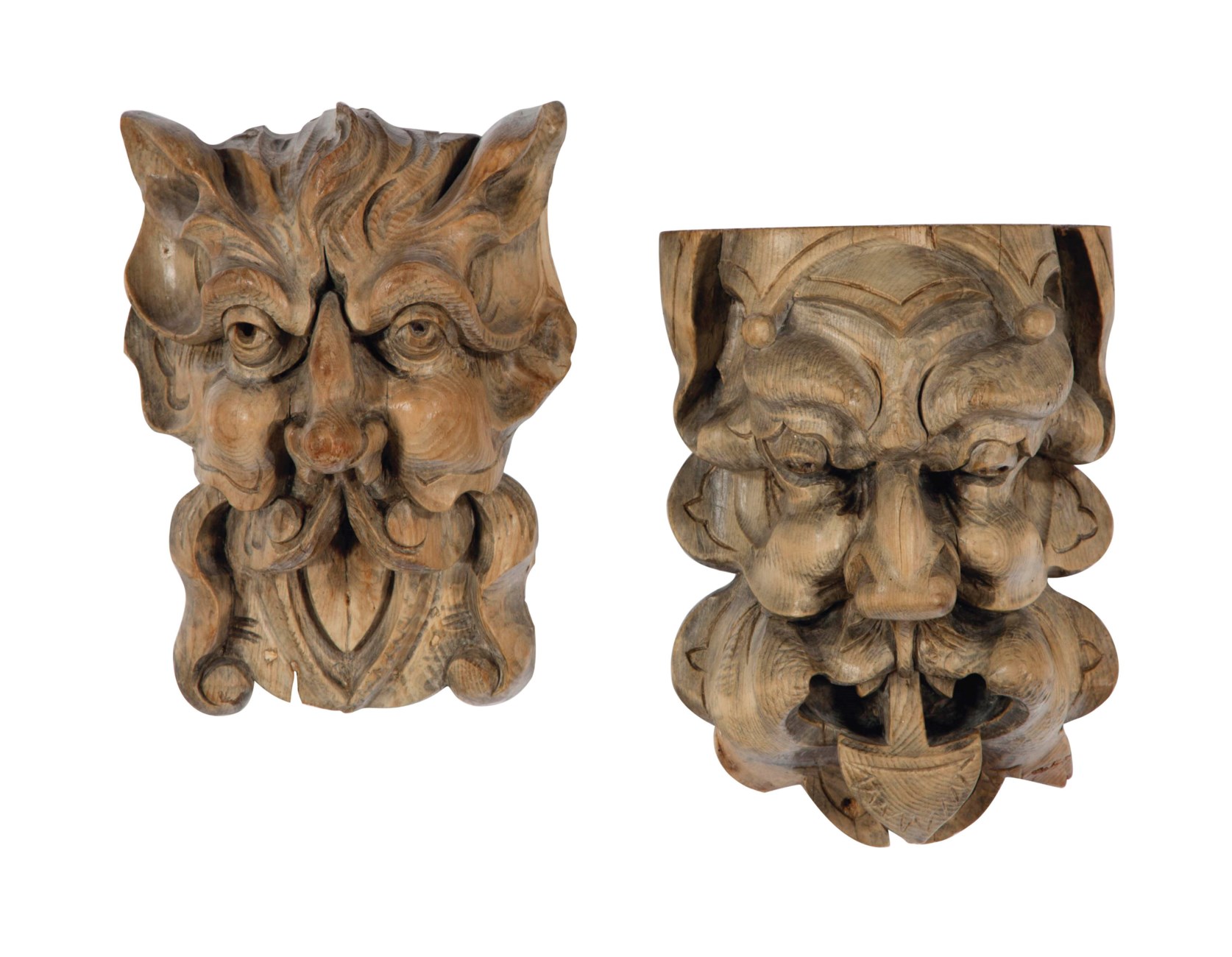 A PAIR OF CONTINENTAL CARVED PINE GROTESQUE MASKS, , 20TH CENTURY ...