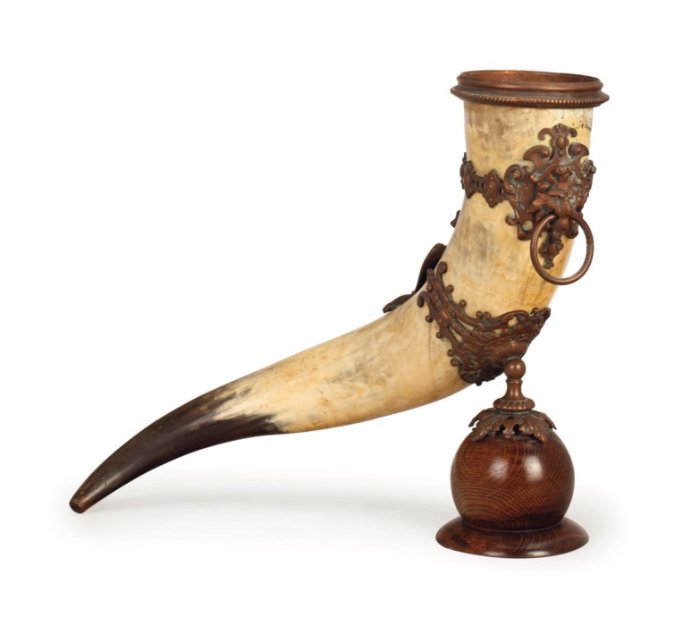 A VICTORIAN PATINATED-METAL-MOUNTED HORN ON AN OAK BASE, , POSSIBLY ...
