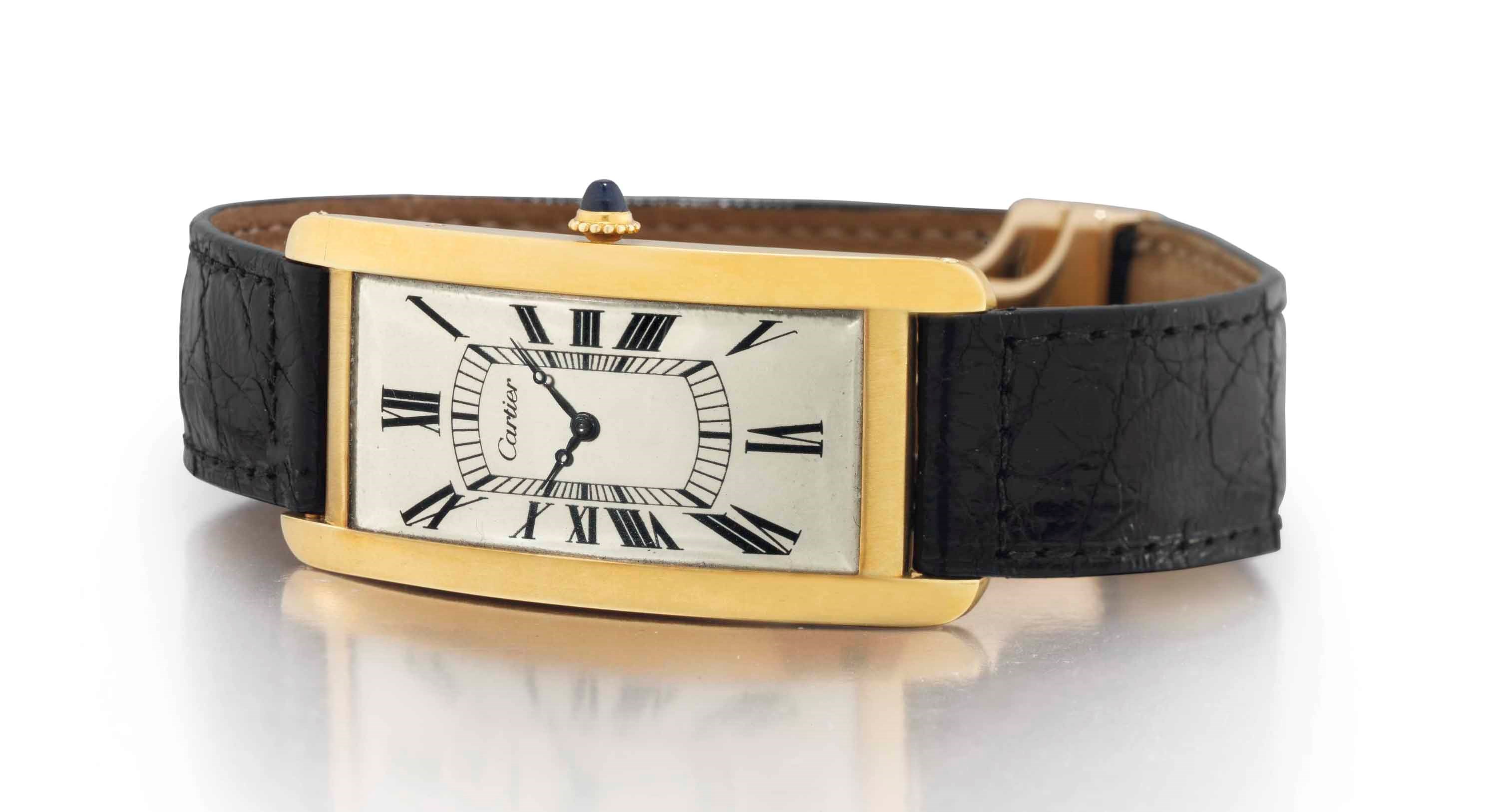 Cartier. A Rare and Oversized 18k Gold Rectangular Curved Wristwatch
