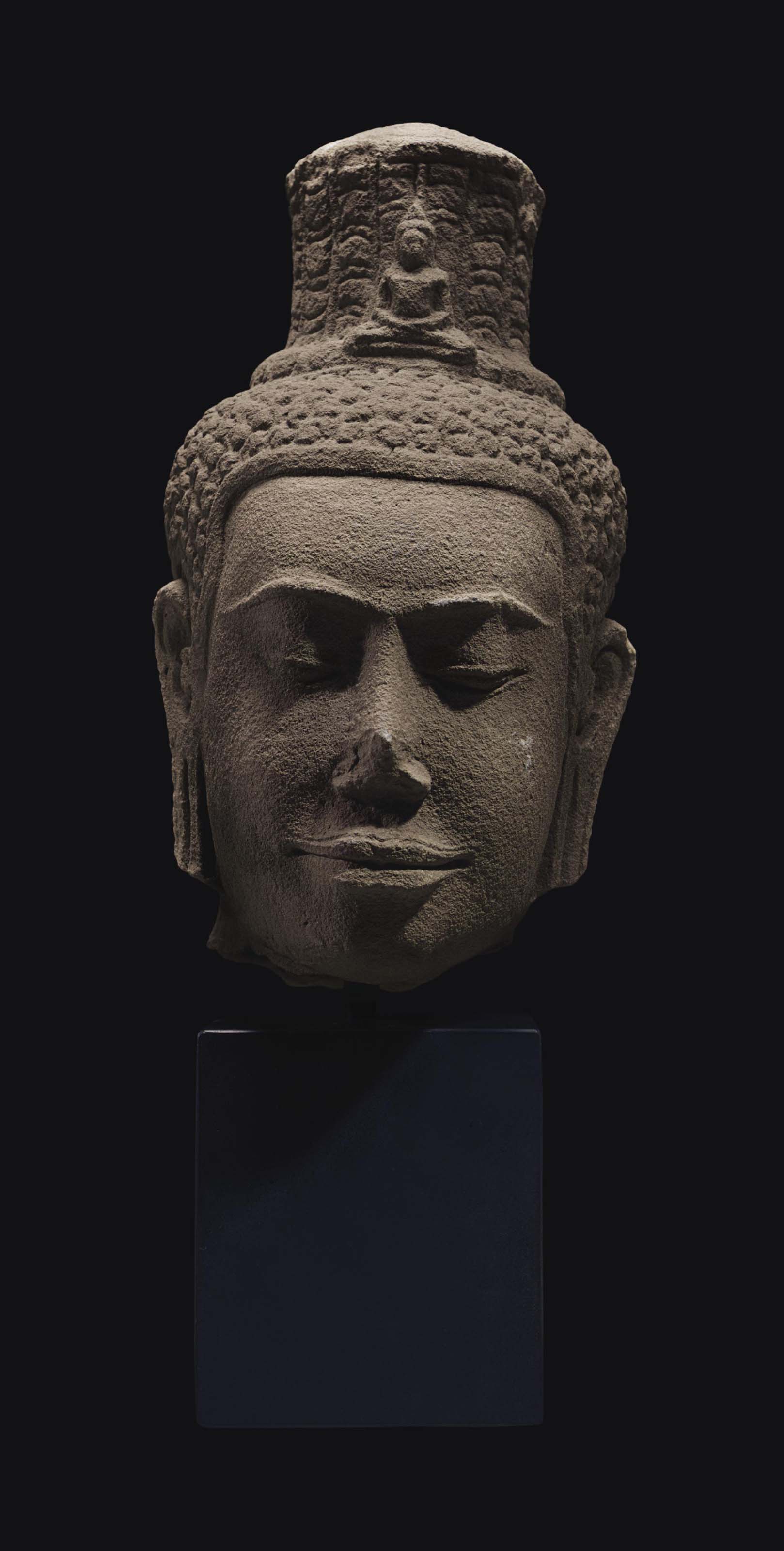 A sandstone torso of a male deity , KHMER, ANGKOR PERIOD, BAKHENG STYLE ...