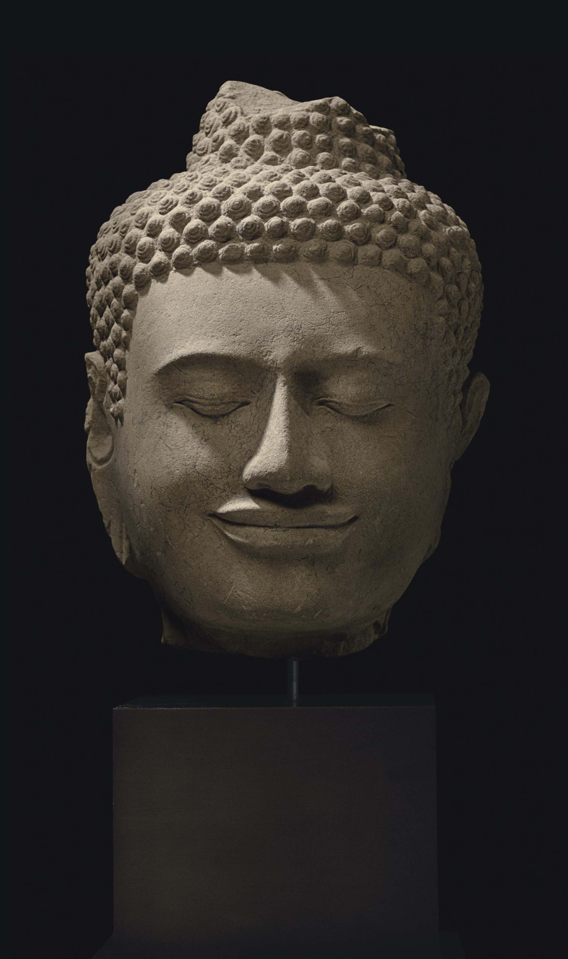 A sandstone torso of a male deity , KHMER, ANGKOR PERIOD, BAKHENG STYLE ...