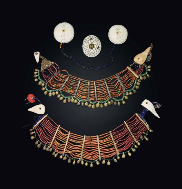 Two ceremonial glass-bead necklaces and three conch-shell ear covers ...