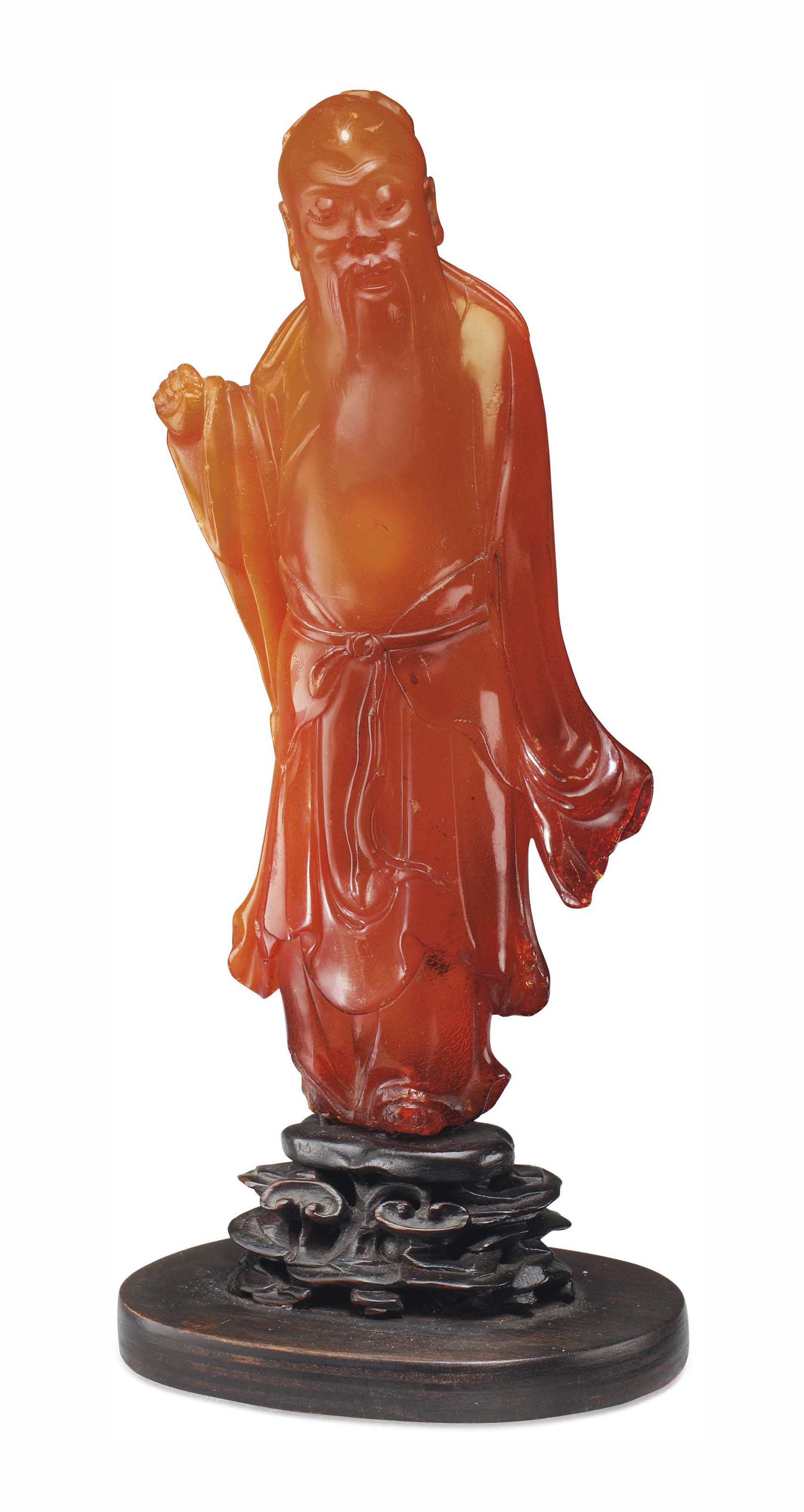 A RARE LARGE AMBER FIGURE OF A DAOIST IMMORTAL