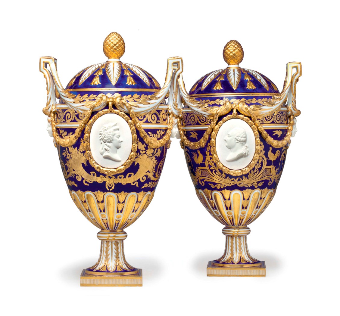 A PAIR OF SEVRES PORCELAIN BLEU NOUVEAU TWO-HANDLED VASES AND COVERS ...