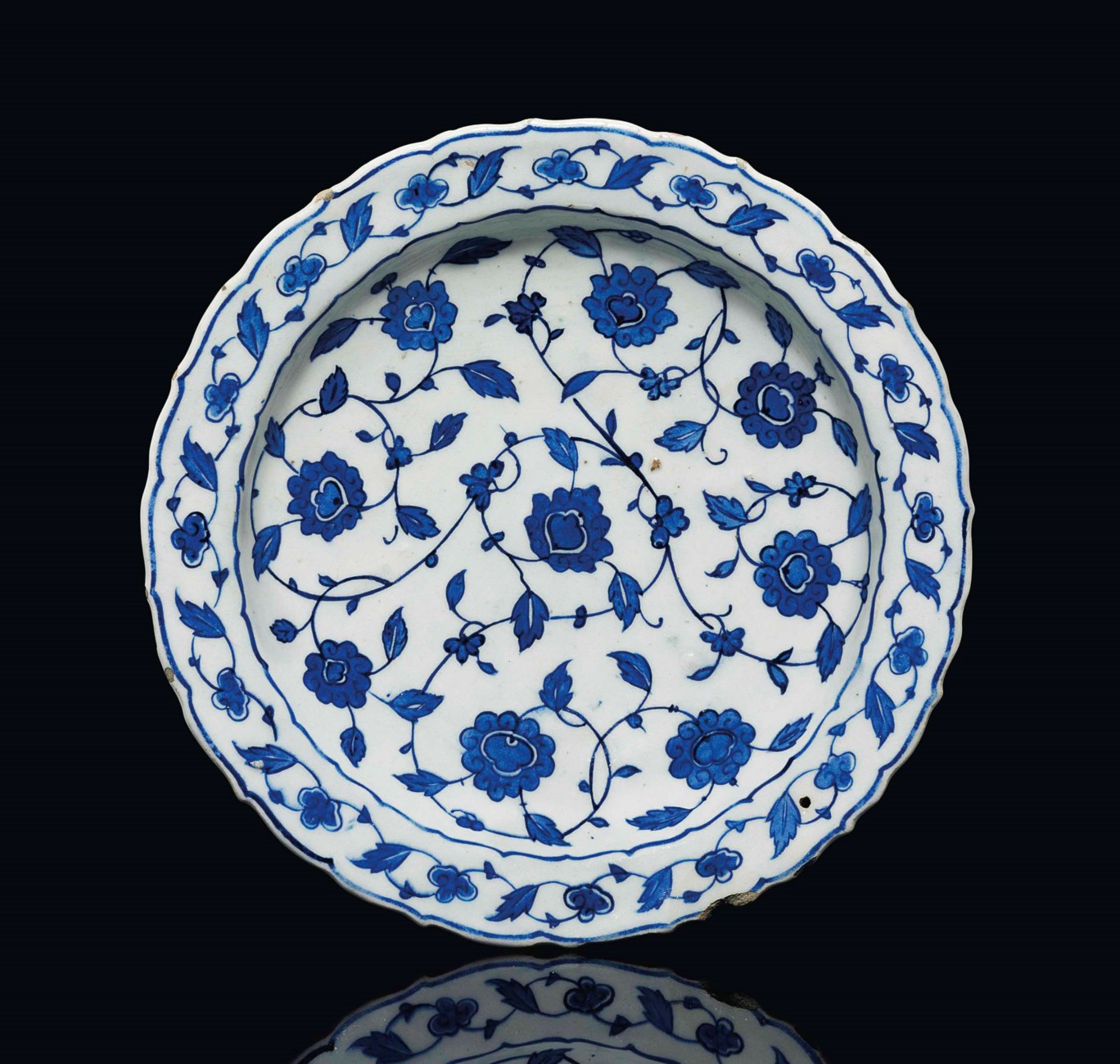 AN IZNIK BLUE AND WHITE POTTERY DISH , OTTOMAN TURKEY, CIRCA 1560 ...