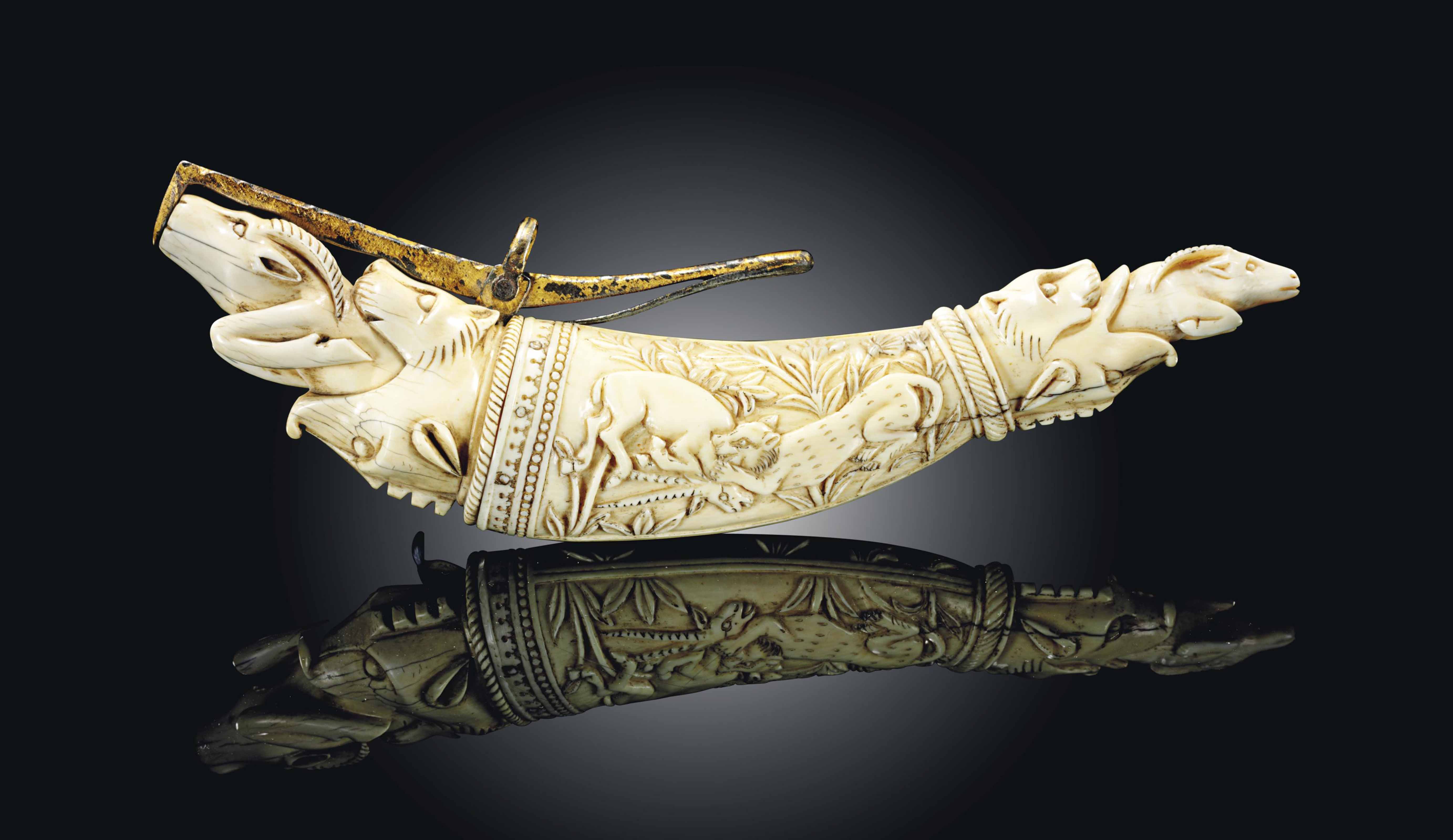 AN IVORY POWDER HORN