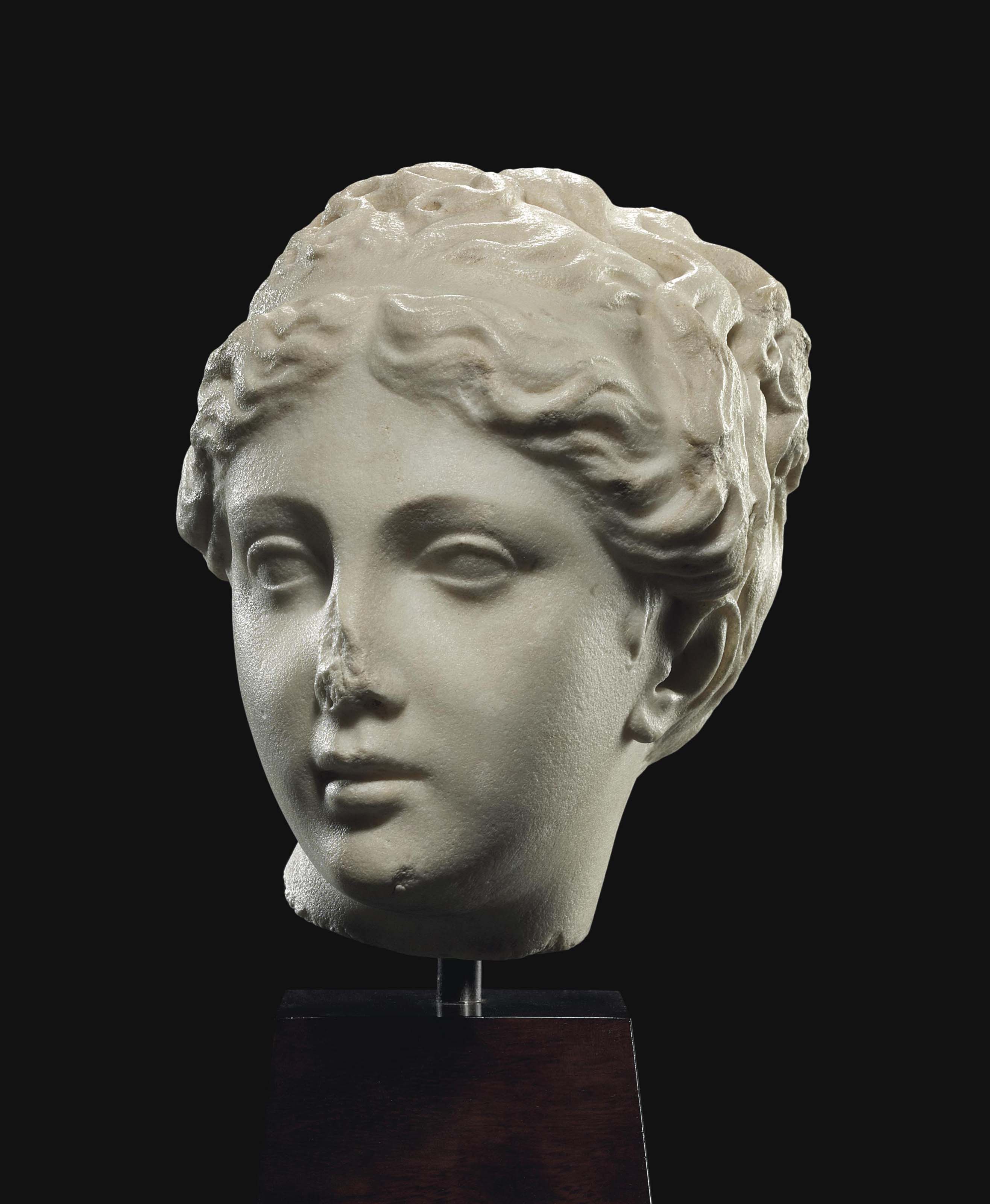 A ROMAN MARBLE FEMALE HEAD , CIRCA LATE 1ST CENTURY B.C.-EARLY 1ST ...