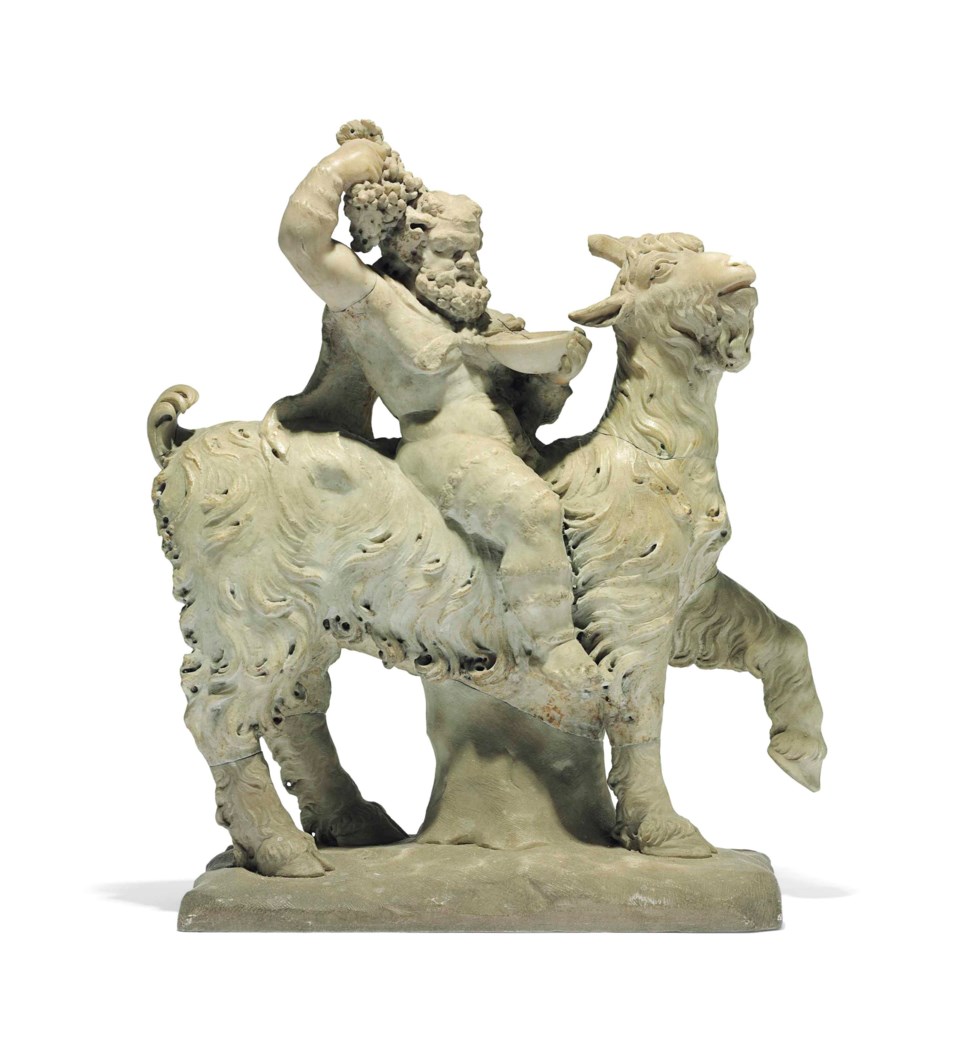 A ROMAN MARBLE GROUP OF SILENUS RIDING A GOAT