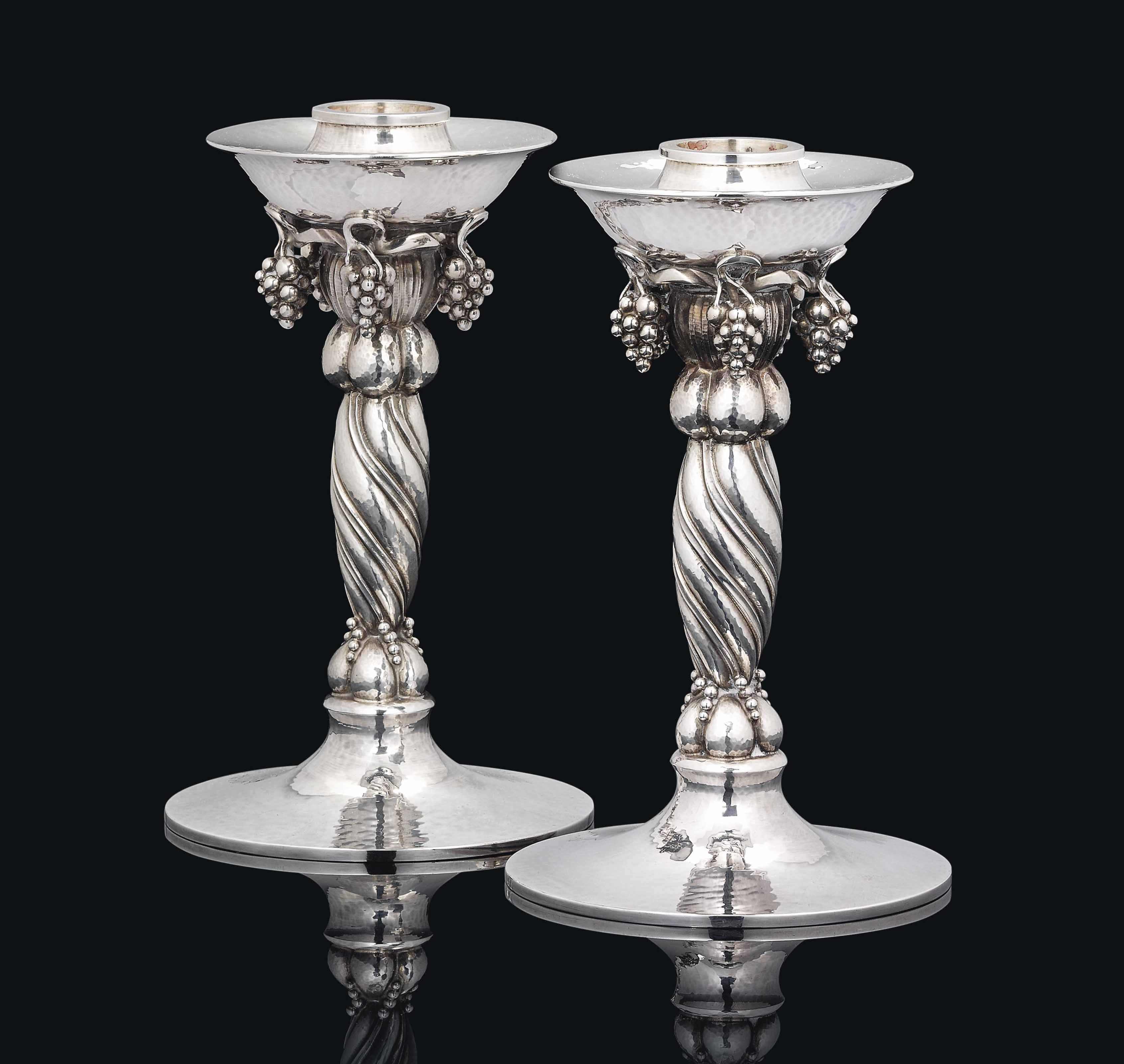 A PAIR OF GEORG JENSEN (EST.1904) 'GRAPE PATTERN' SILVER CANDLESTICKS ...