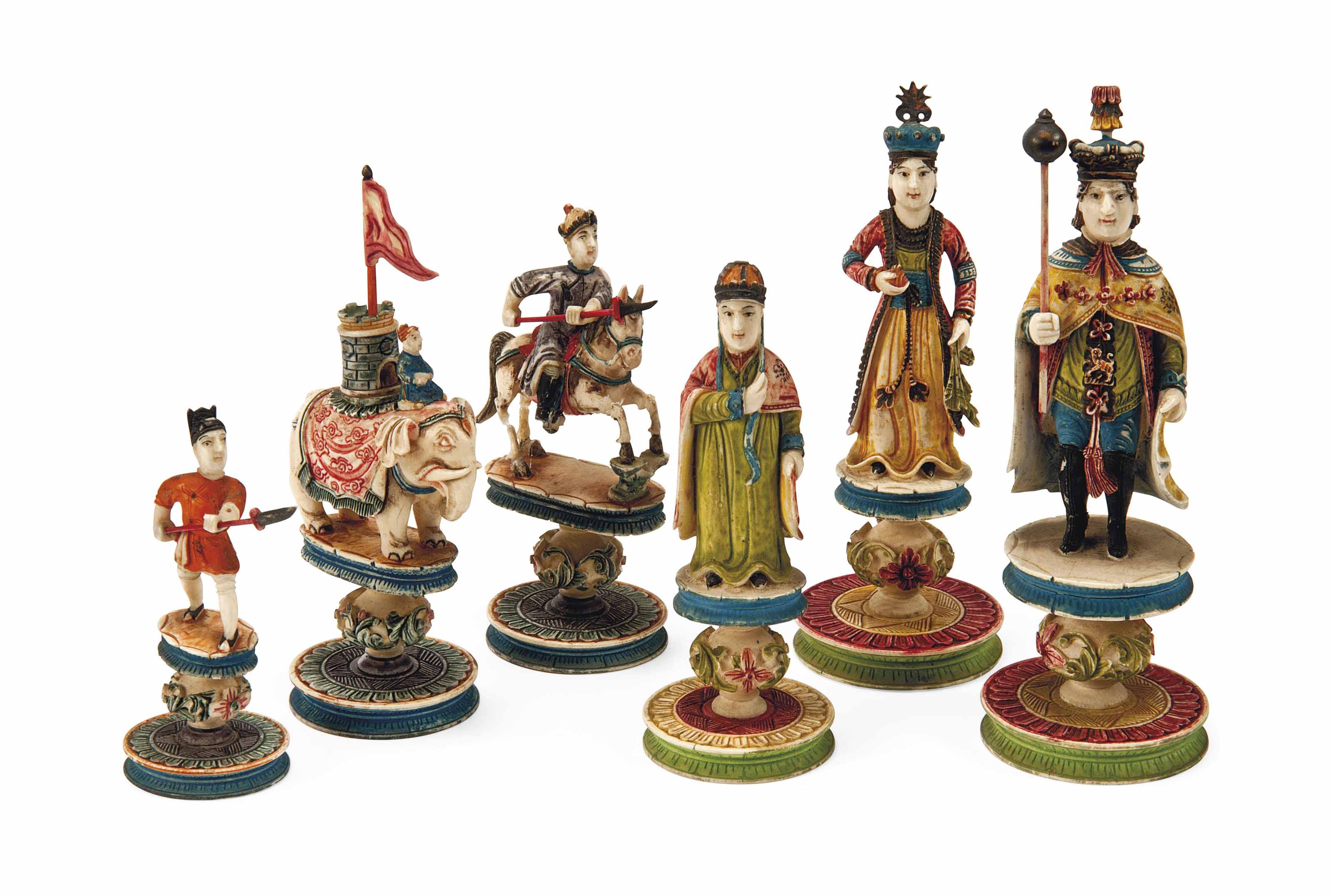 AN INDIAN GILT-HEIGHTENED POLYCHROME IVORY FIGURAL CHESS SET ...