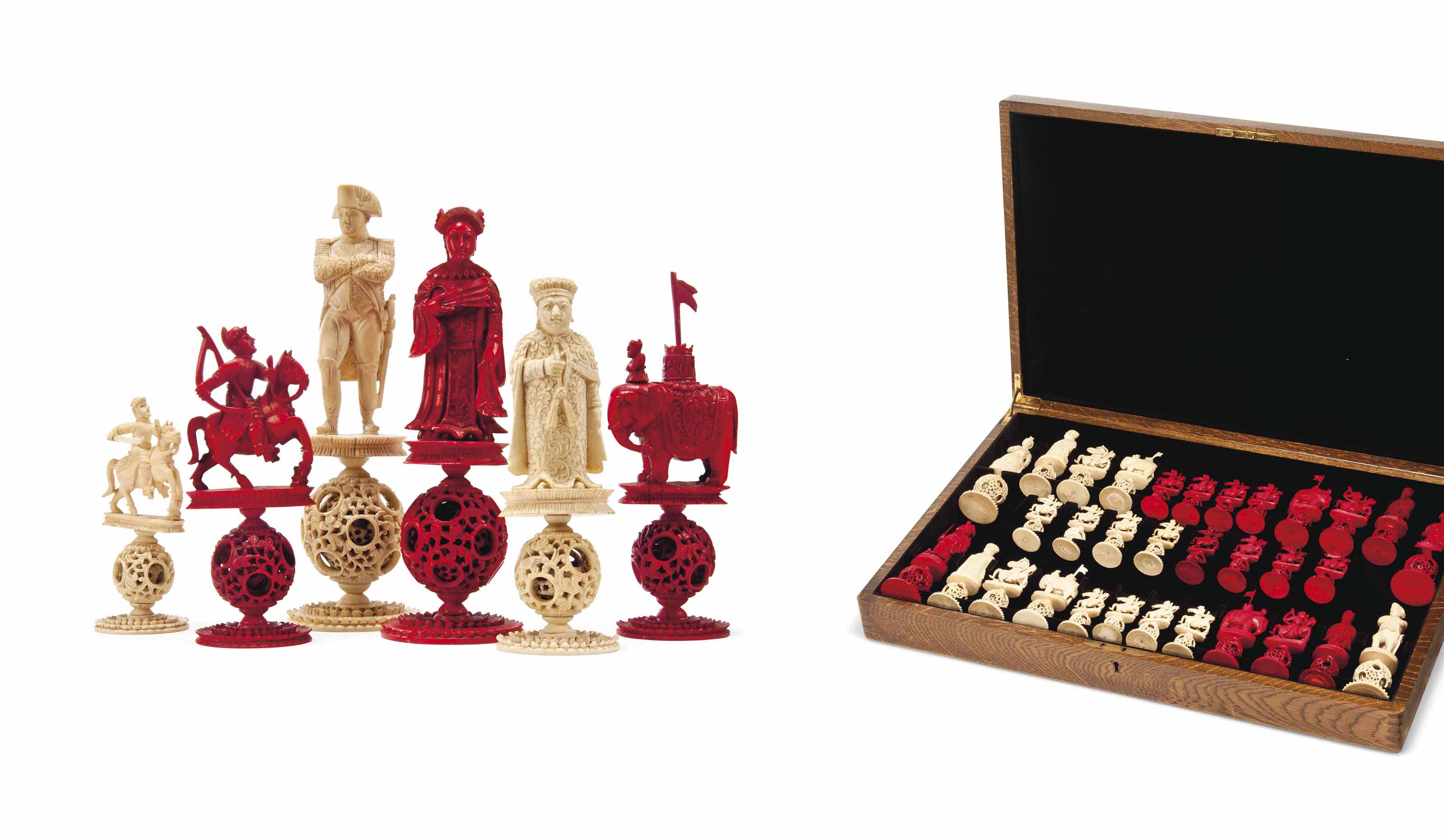 AN INDIAN GILT-HEIGHTENED POLYCHROME IVORY FIGURAL CHESS SET ...