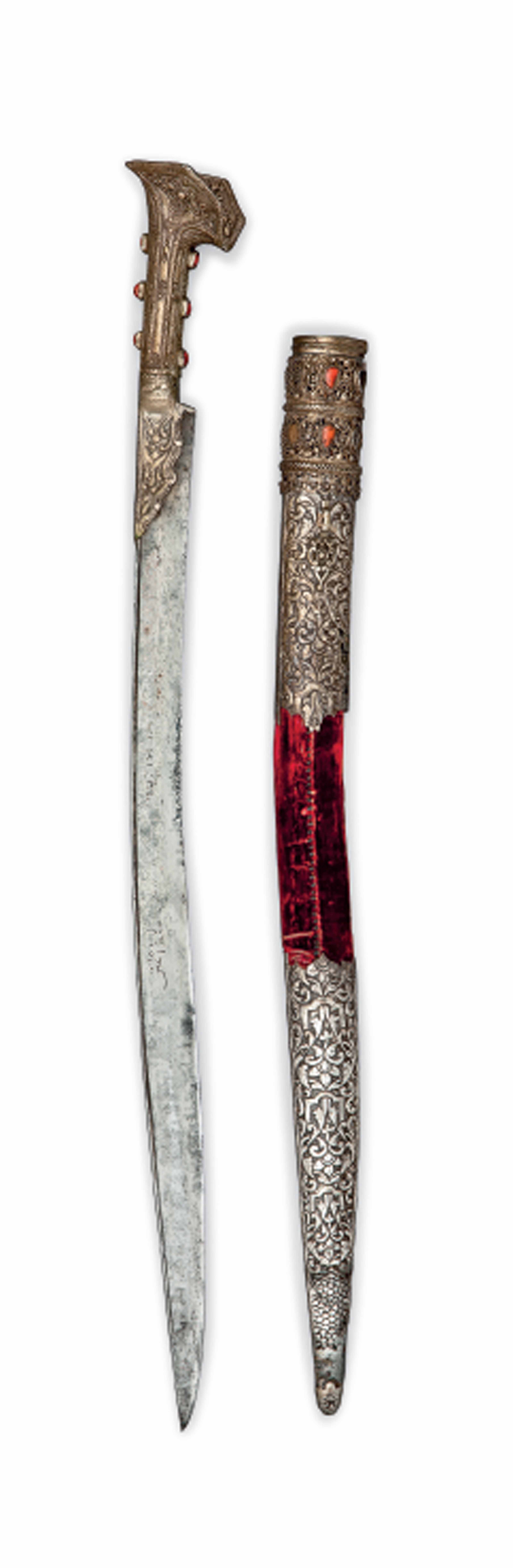 AN OTTOMAN CORAL-INSET PARCEL-GILT YATAGHAN