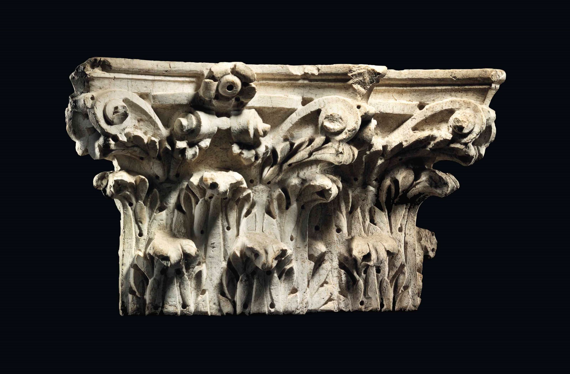 A ROMAN LIMESTONE CORINTHIAN DOUBLE PILASTER CAPITAL