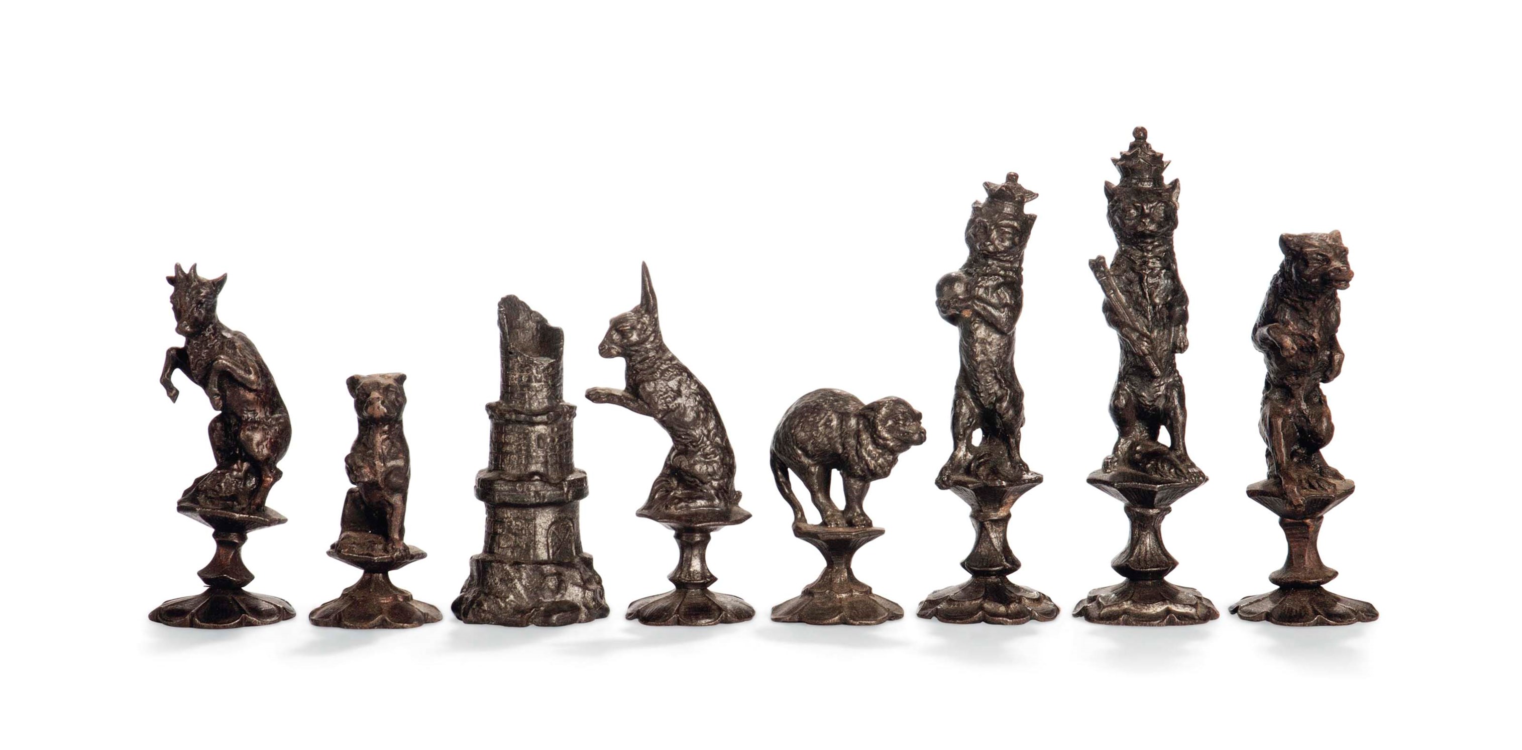 A GERMAN CAST IRON 'REYNARD THE FOX' CHESS SET