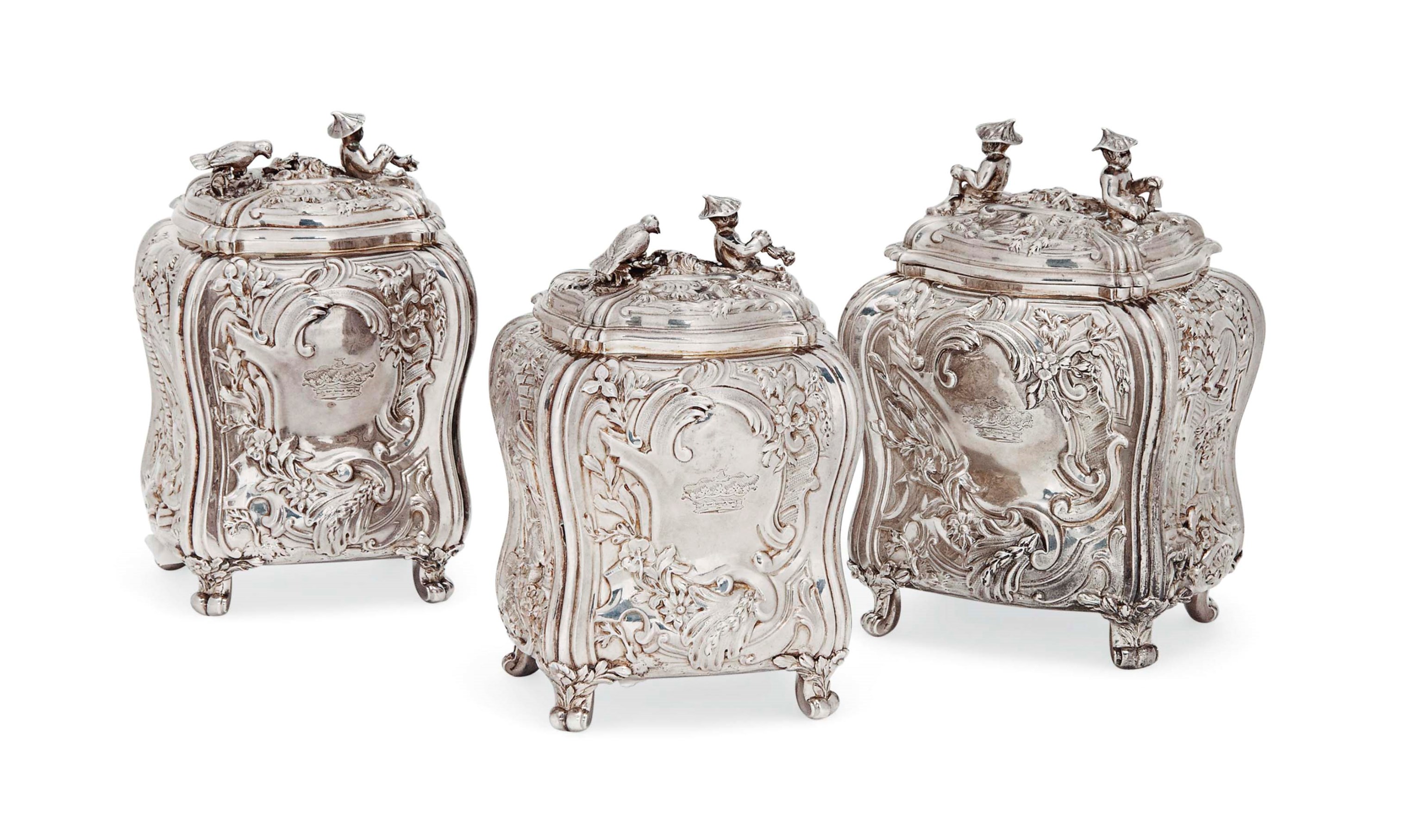 A MATCHING SET OF THREE GEORGE III ROCOCO SILVER TEA CADDIES