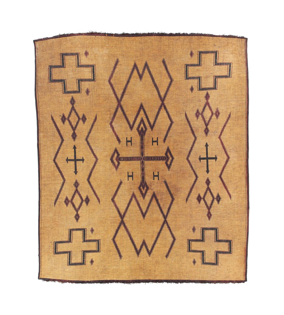A most unusual reeds and leather North African floor mat