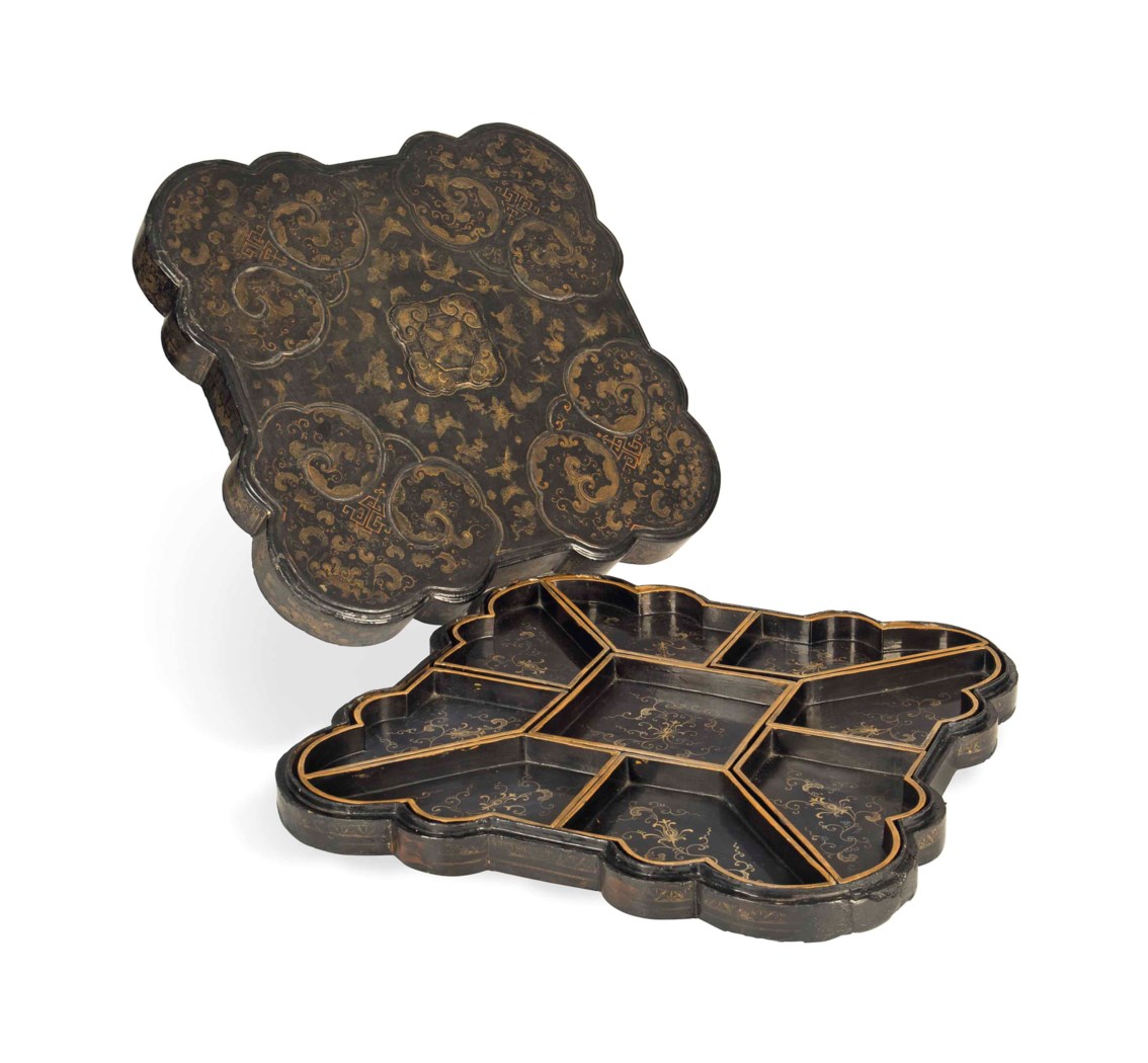 A LARGE CHINESE GILT AND BLACK LACQUERED SWEET MEAT BOX AND COVER ...