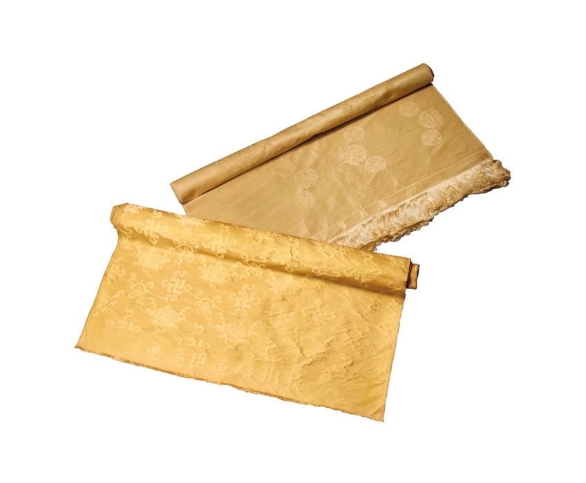 TWO YELLOW SILK FABRIC BOLTS, CIRCA 1900 | Christie's