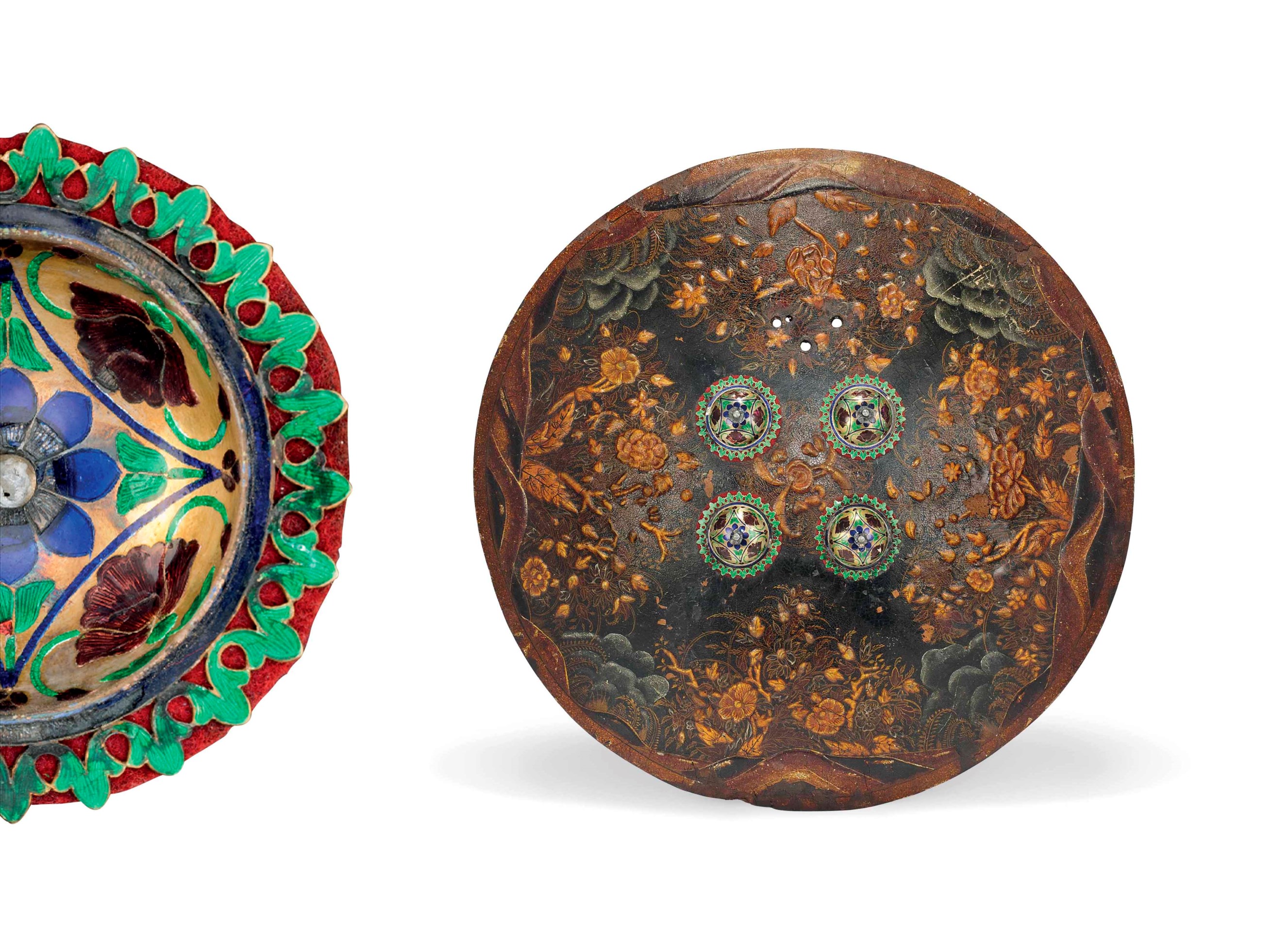 A LACQUERED HIDE SHIELD WITH ENAMELLED SILVER BOSSES , PROBABLY LUCKNOW ...