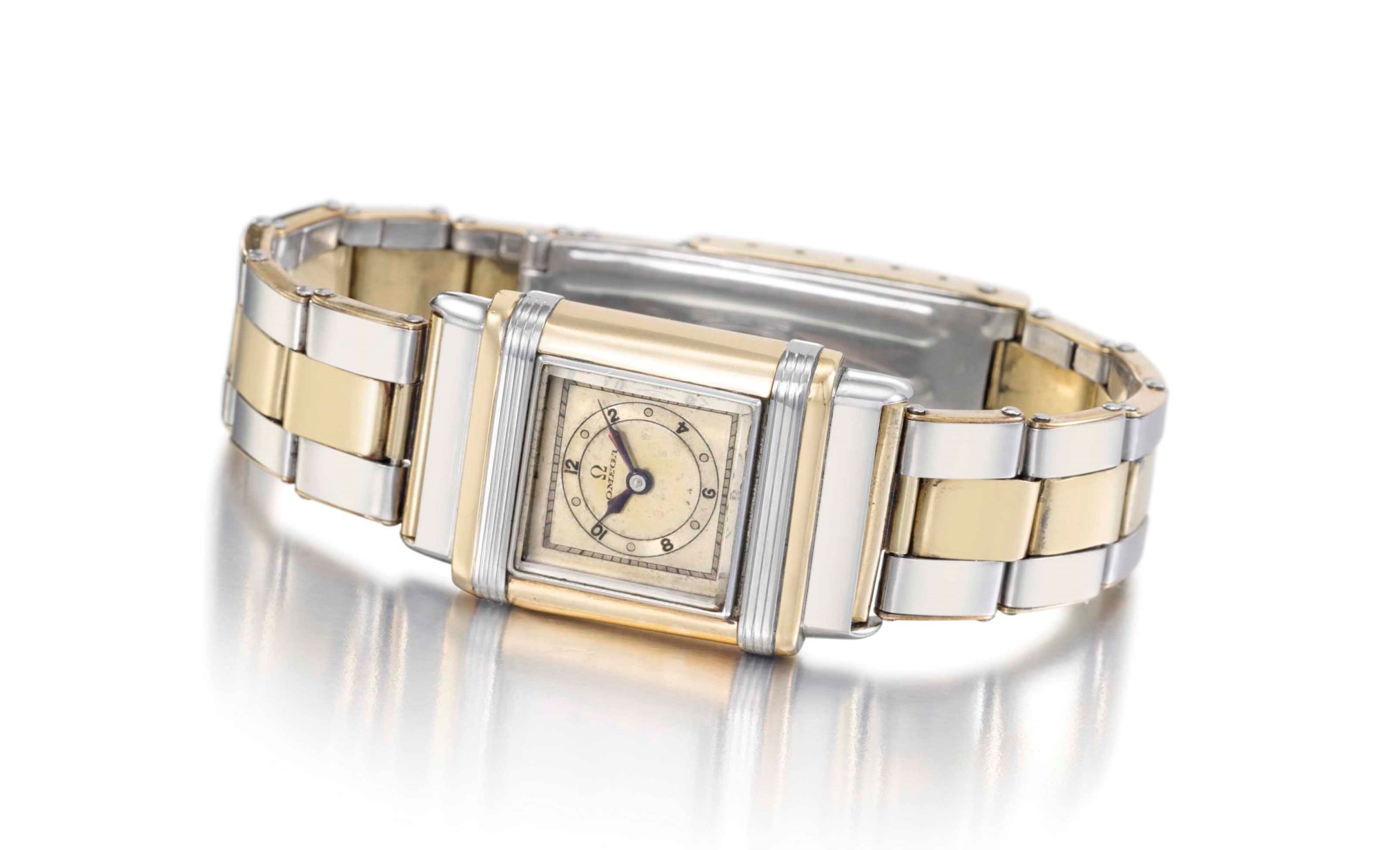 Omega. An early 18K gold and stainless steel square wristwatch with ...