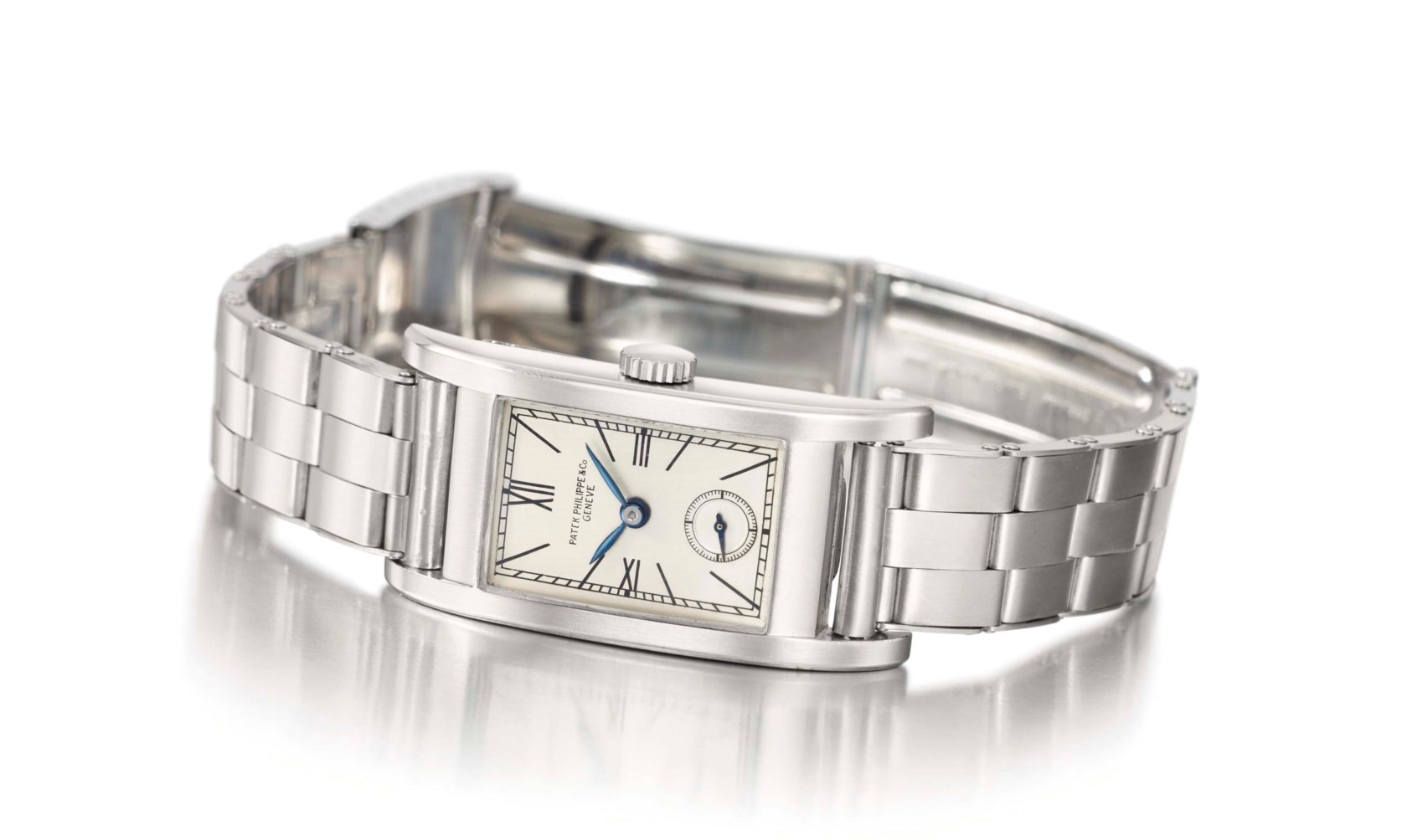 Patek Philippe. A fine and rare stainless steel rectangular curved ...
