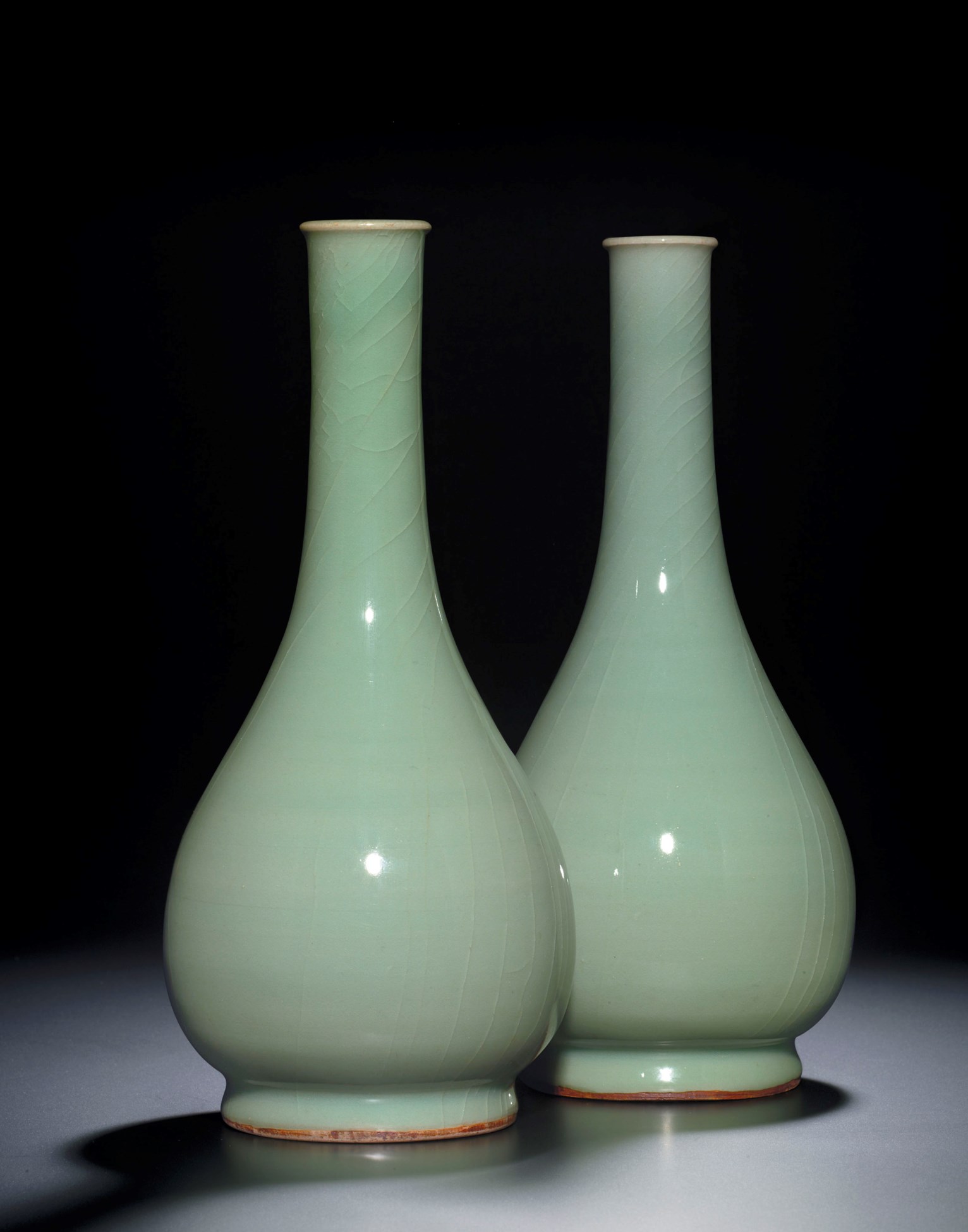 AN UNUSUAL PAIR OF LONGQUAN CELADON BOTTLE VASES, MING DYNASTY, 15TH ...