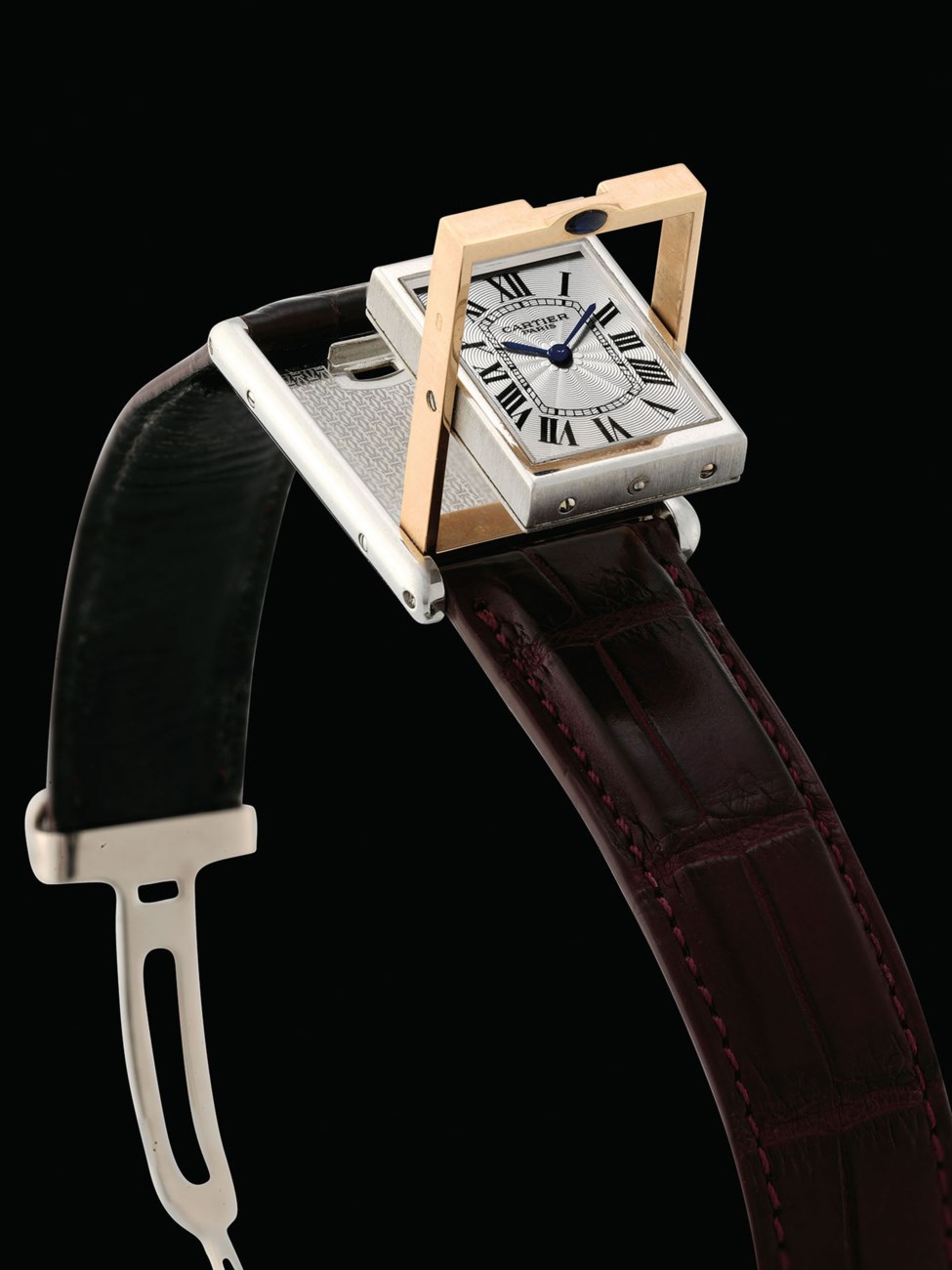 CARTIER. A RARE PLATINUM AND 18K PINK GOLD LIMITED EDITION RECTANGULAR ...