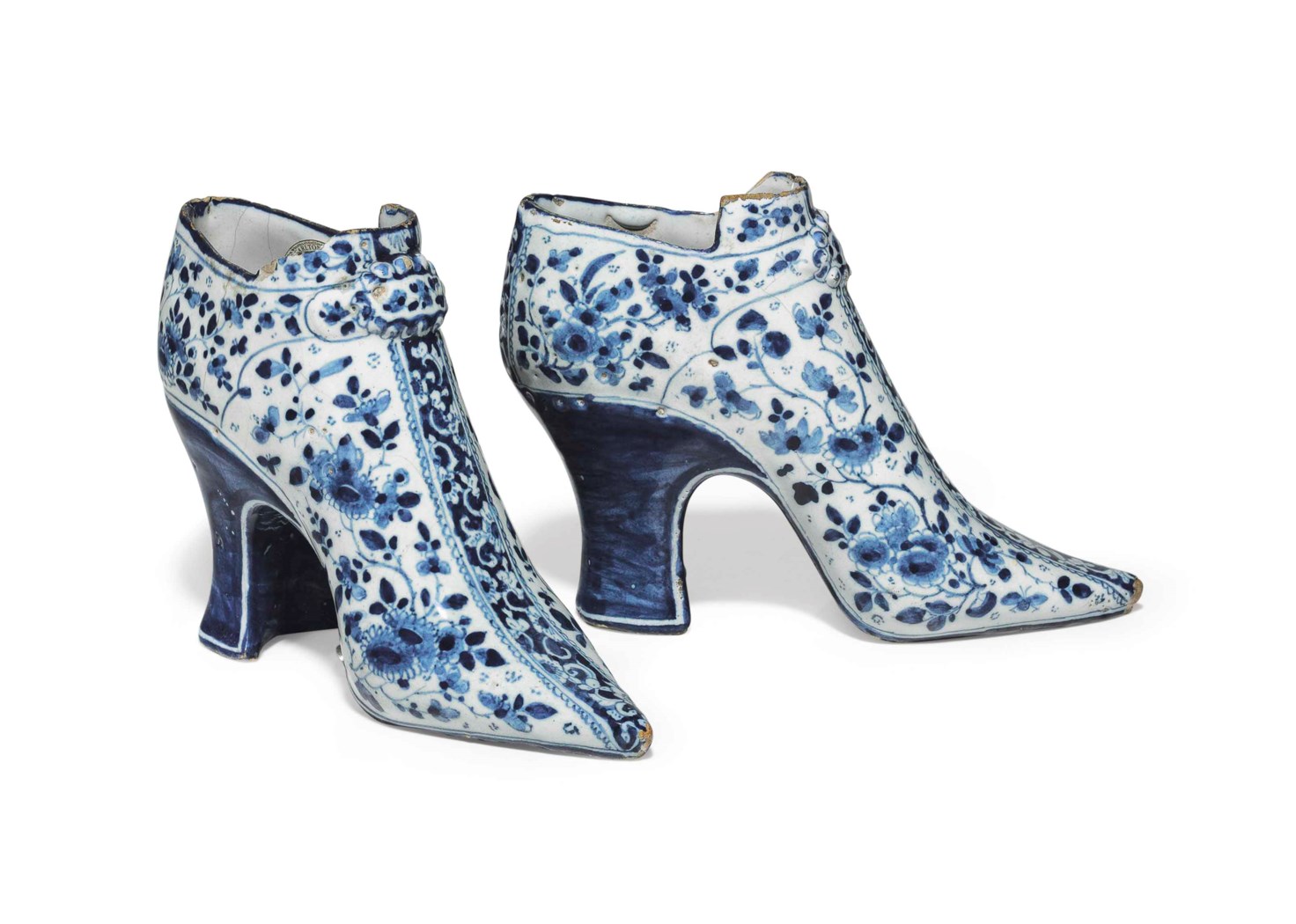 A PAIR OF ENGLISH DELFT DATED MODELS OF SHOES , DATED 1727, LONDON OR ...