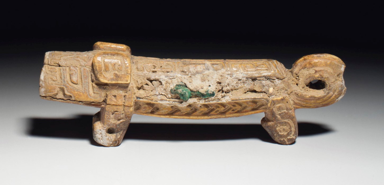 A RARE CARVED BONE FIGURE OF A TIGER , LATE SHANG DYNASTY, 11TH CENTURY ...