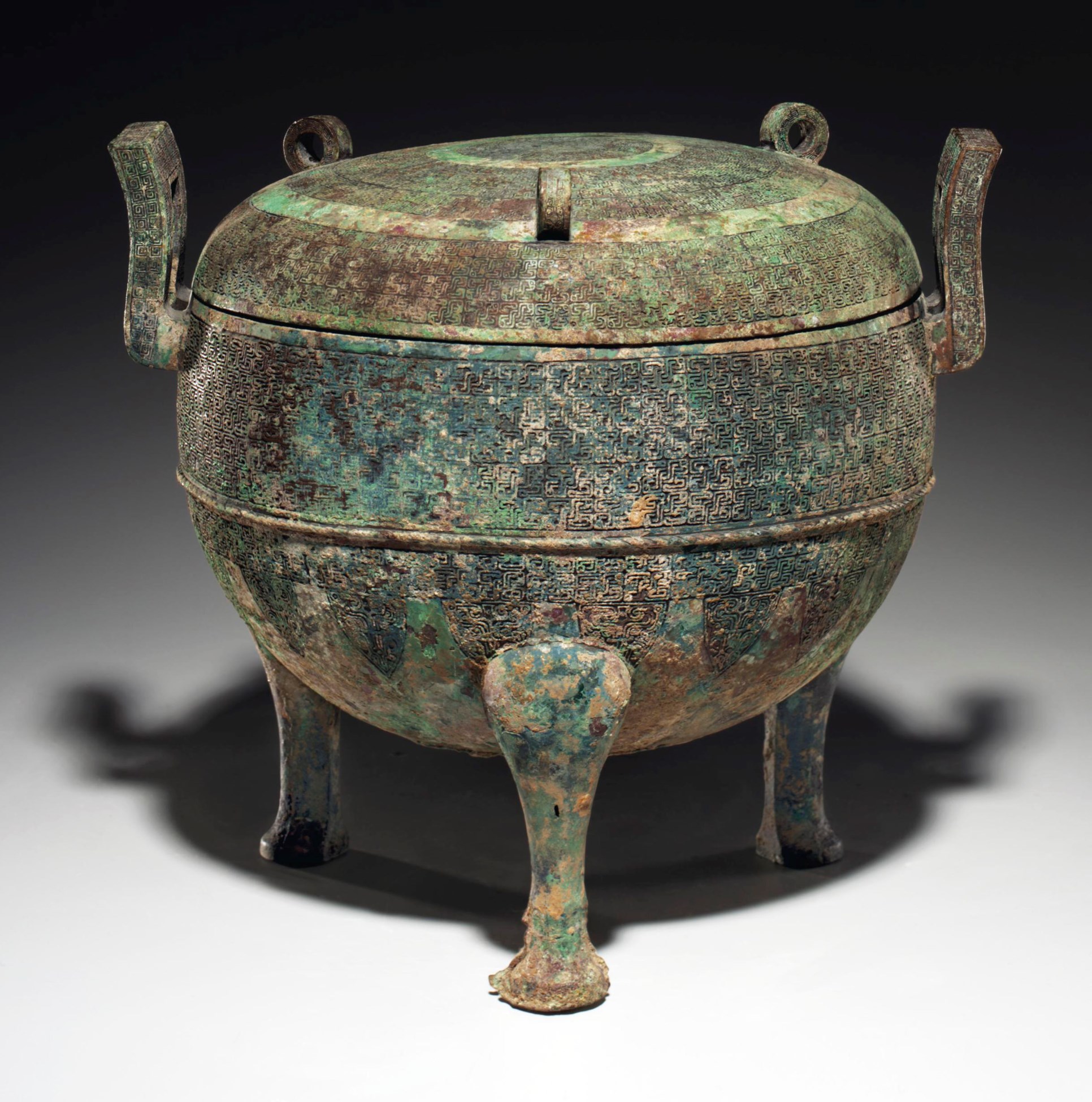 A LARGE BRONZE RITUAL TRIPOD FOOD VESSEL AND COVER, DING , SPRING AND ...