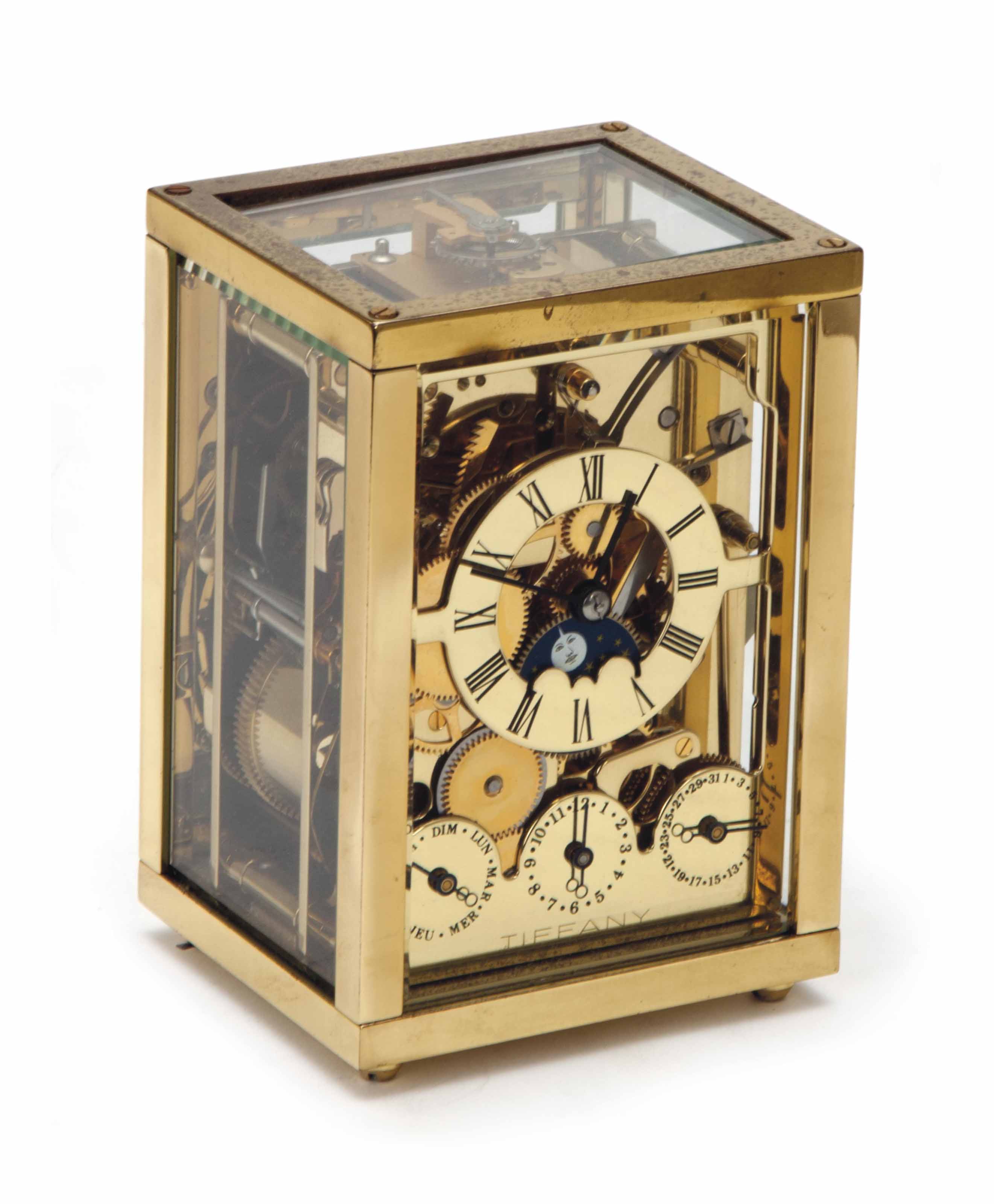 A FRENCH BRASS AND PORCELAIN STRIKE/REPEAT/ALARM CARRIAGE CLOCK BY L ...