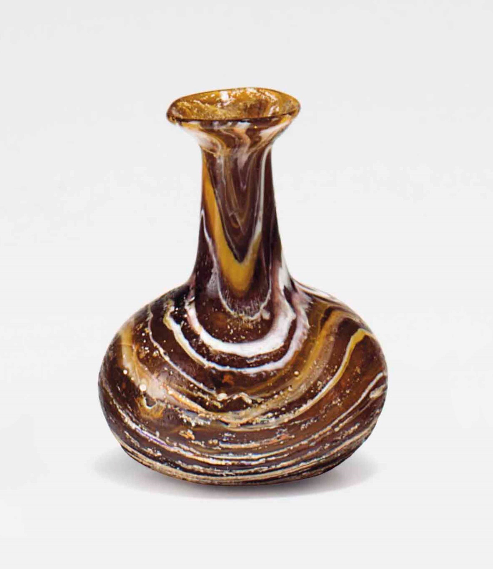 A ROMAN RIBBON GLASS BOTTLE , CIRCA 1ST CENTURY A.D. | Christie's