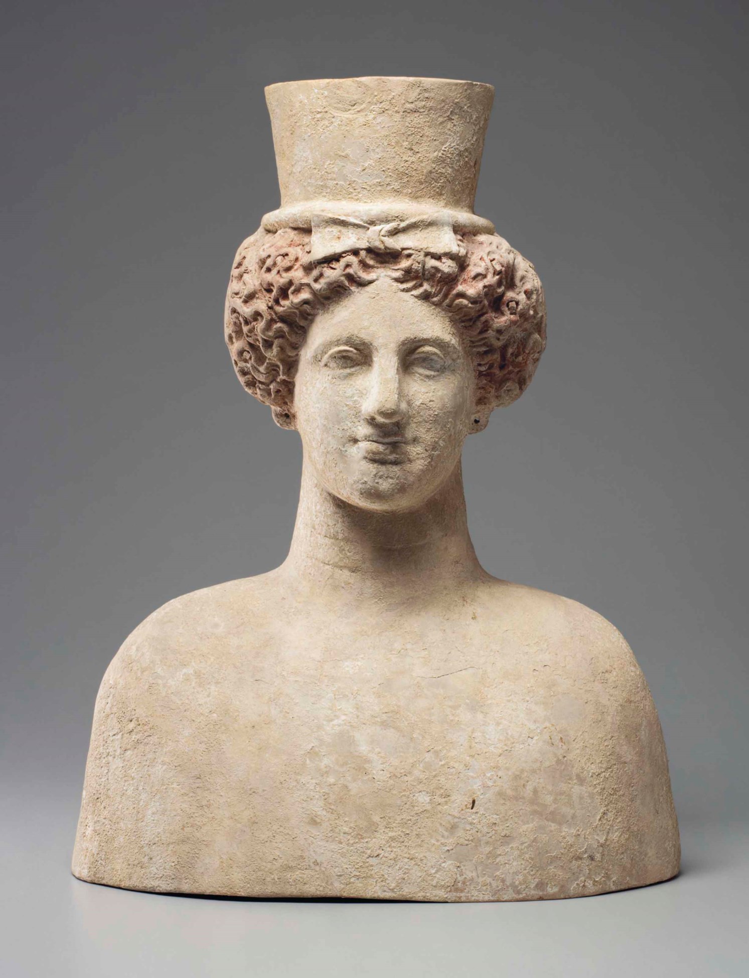 A GREEK TERRACOTTA BUST OF A GODDESS , CLASSICAL PERIOD, MAGNA GRAECIA ...