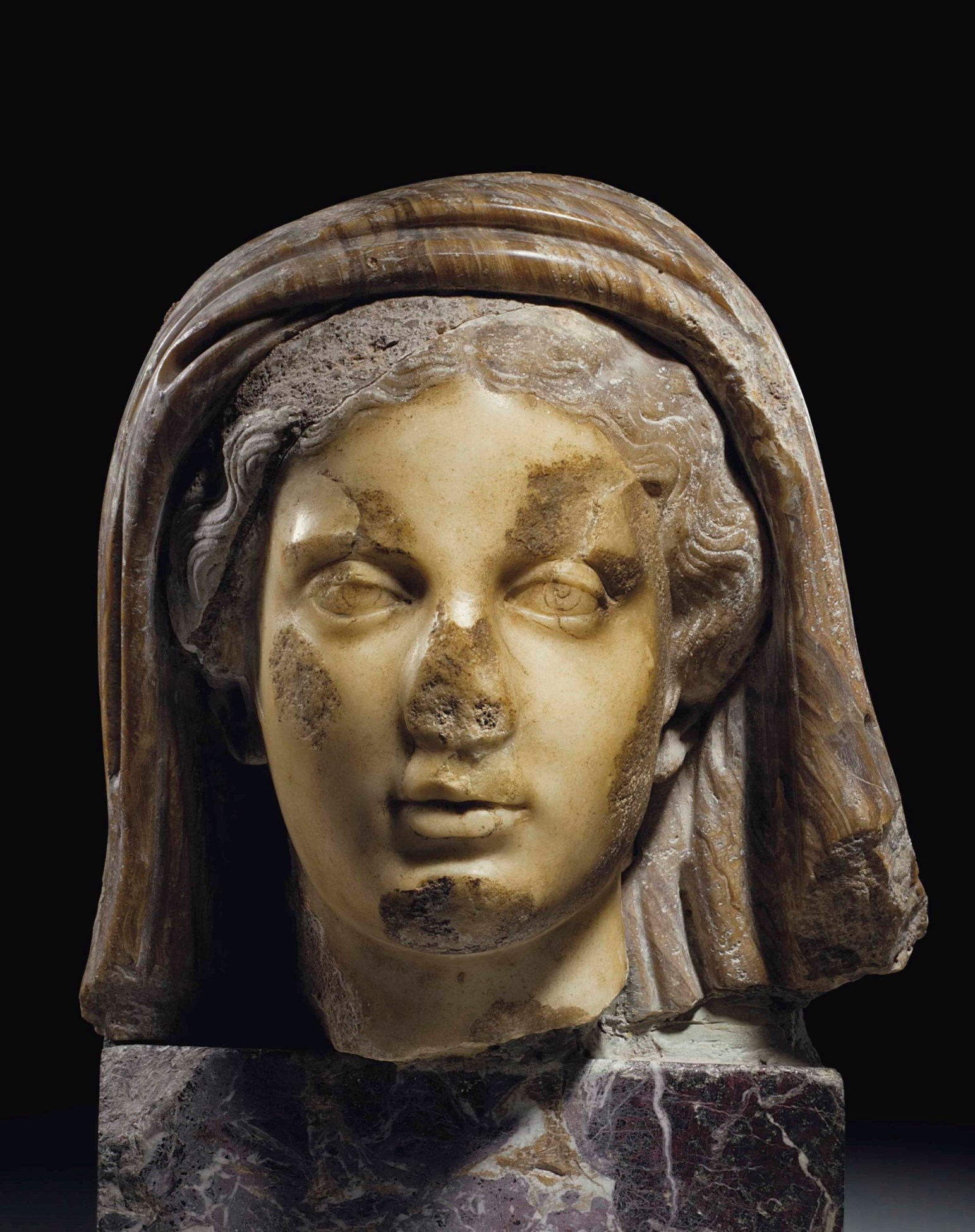 A ROMAN MARBLE PORTRAIT HEAD OF THE EMPRESS FAUSTINA MINOR