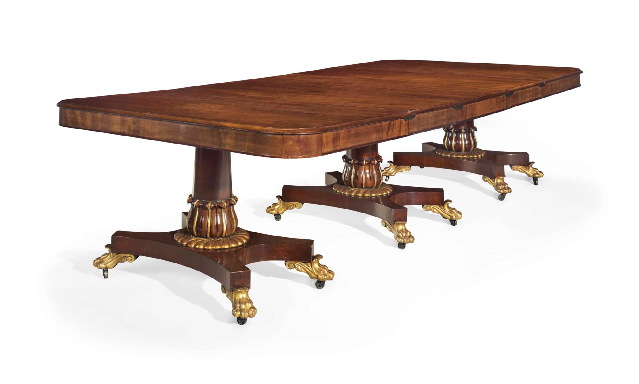 A GEORGE IV PARCEL-GILT MAHOGANY THREE-PEDESTAL DINING TABLE , CIRCA ...