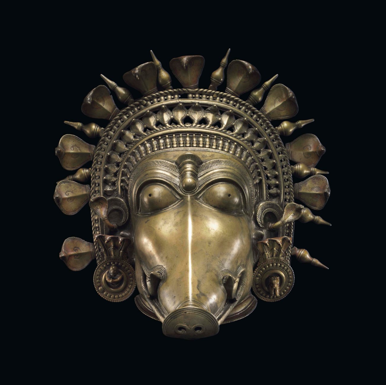 A brass bhuta mask of a boar
