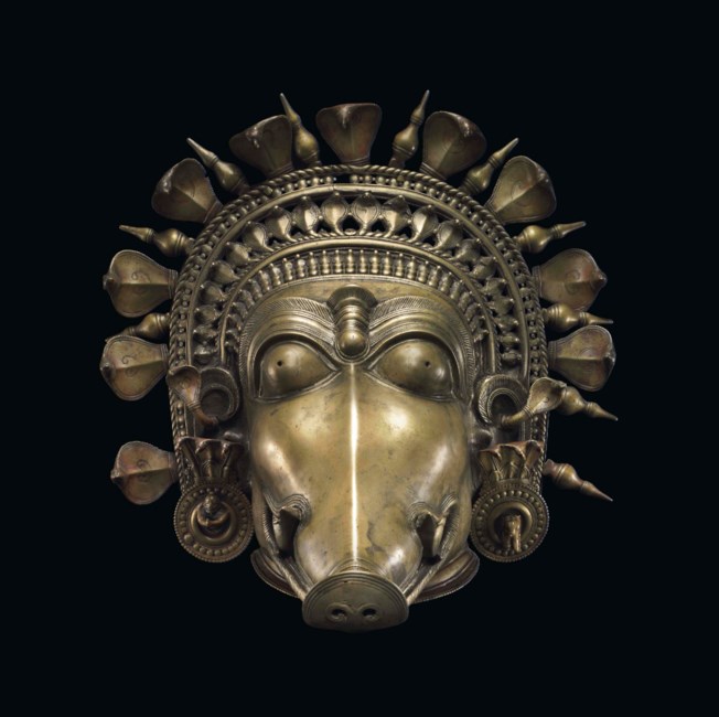 A brass bhuta mask of a boar