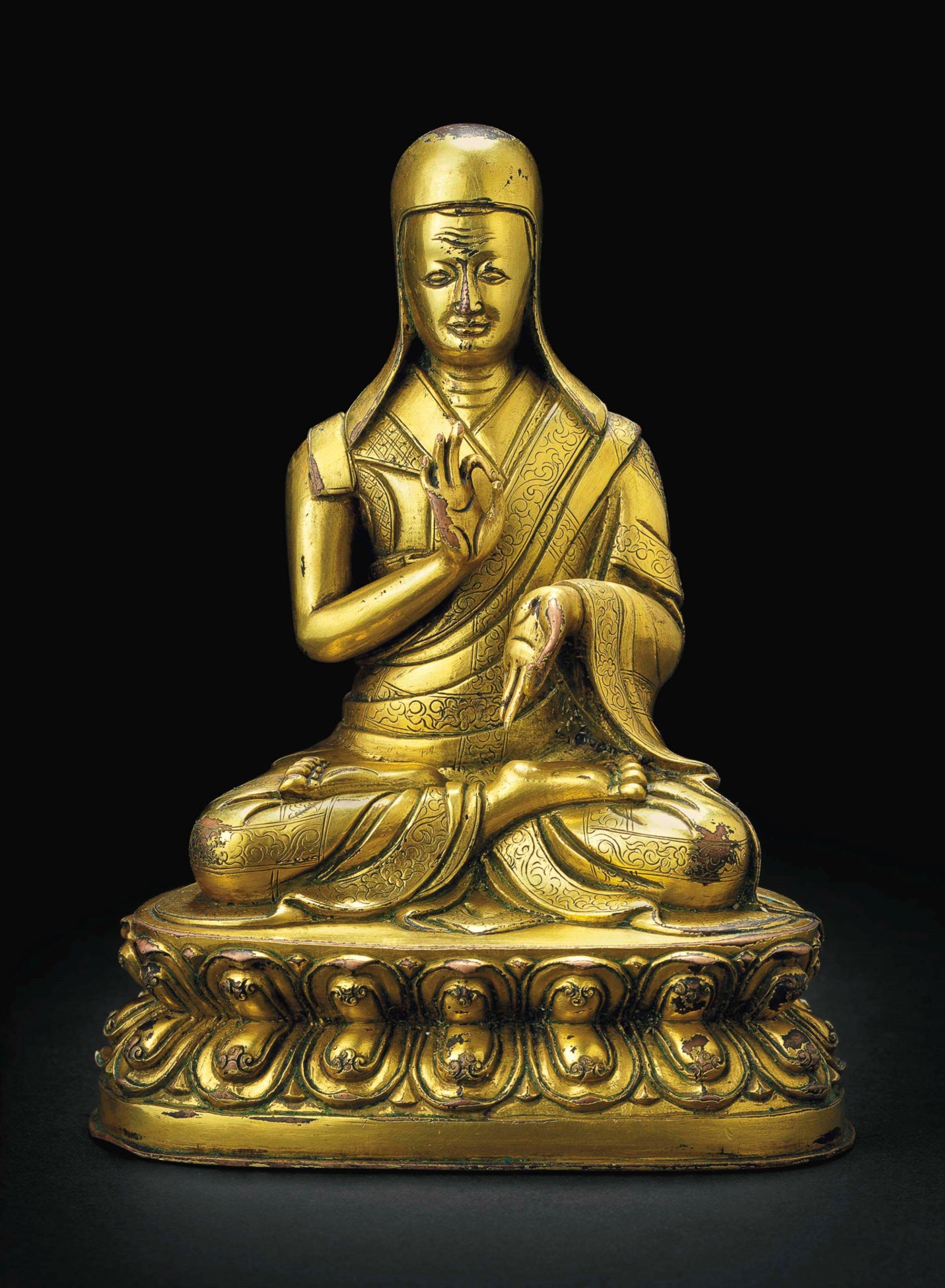 A gilt bronze figure of a Sakya lama , TIBET, 15TH/16TH CENTURY ...