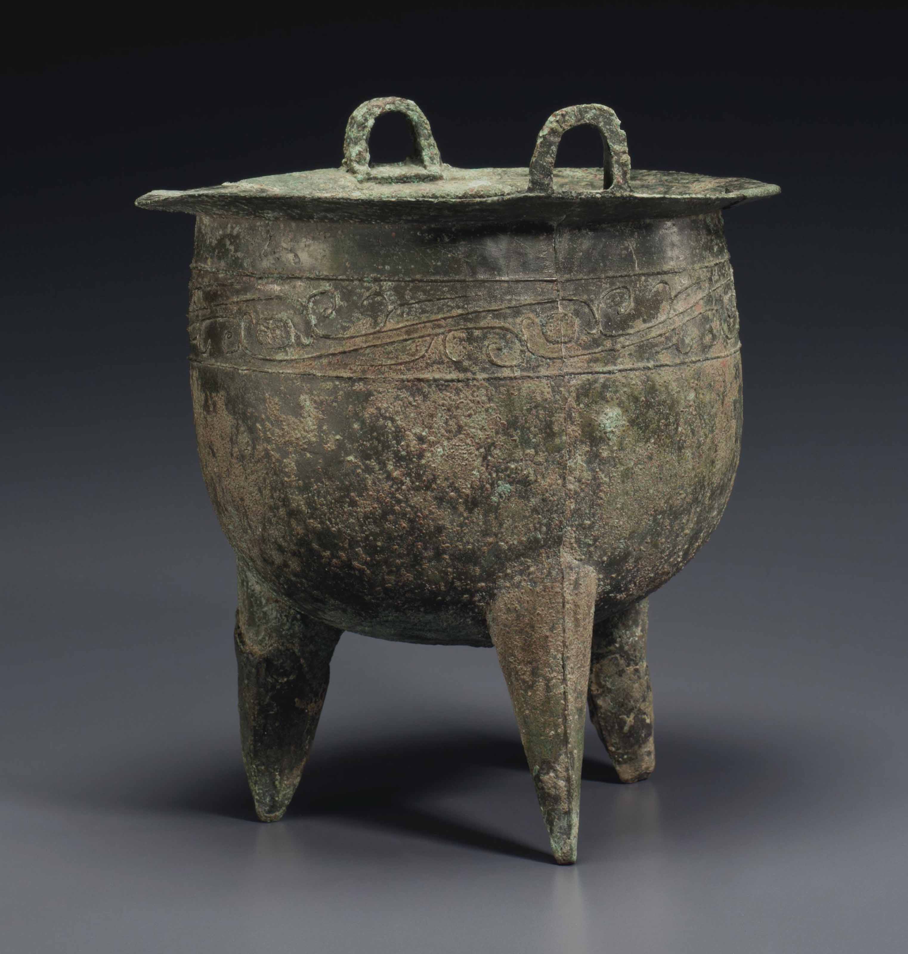 A RARE BRONZE RITUAL TRIPOD WINE VESSEL, JIA , EARLY SHANG DYNASTY ...