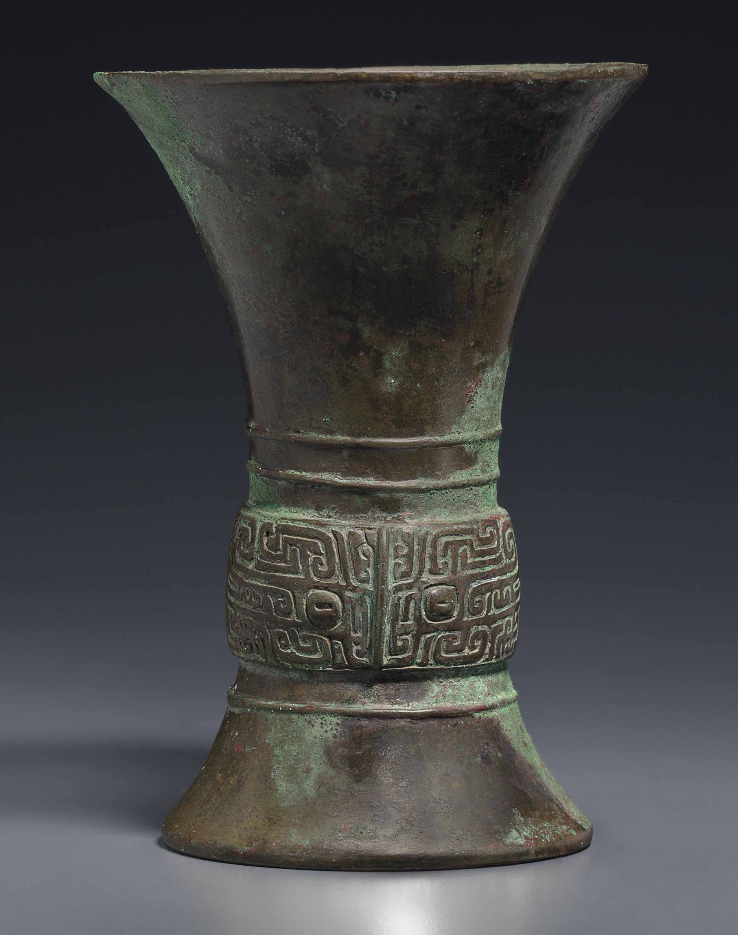 A RARE BRONZE RITUAL TRIPOD WINE VESSEL, JIA , EARLY SHANG DYNASTY ...