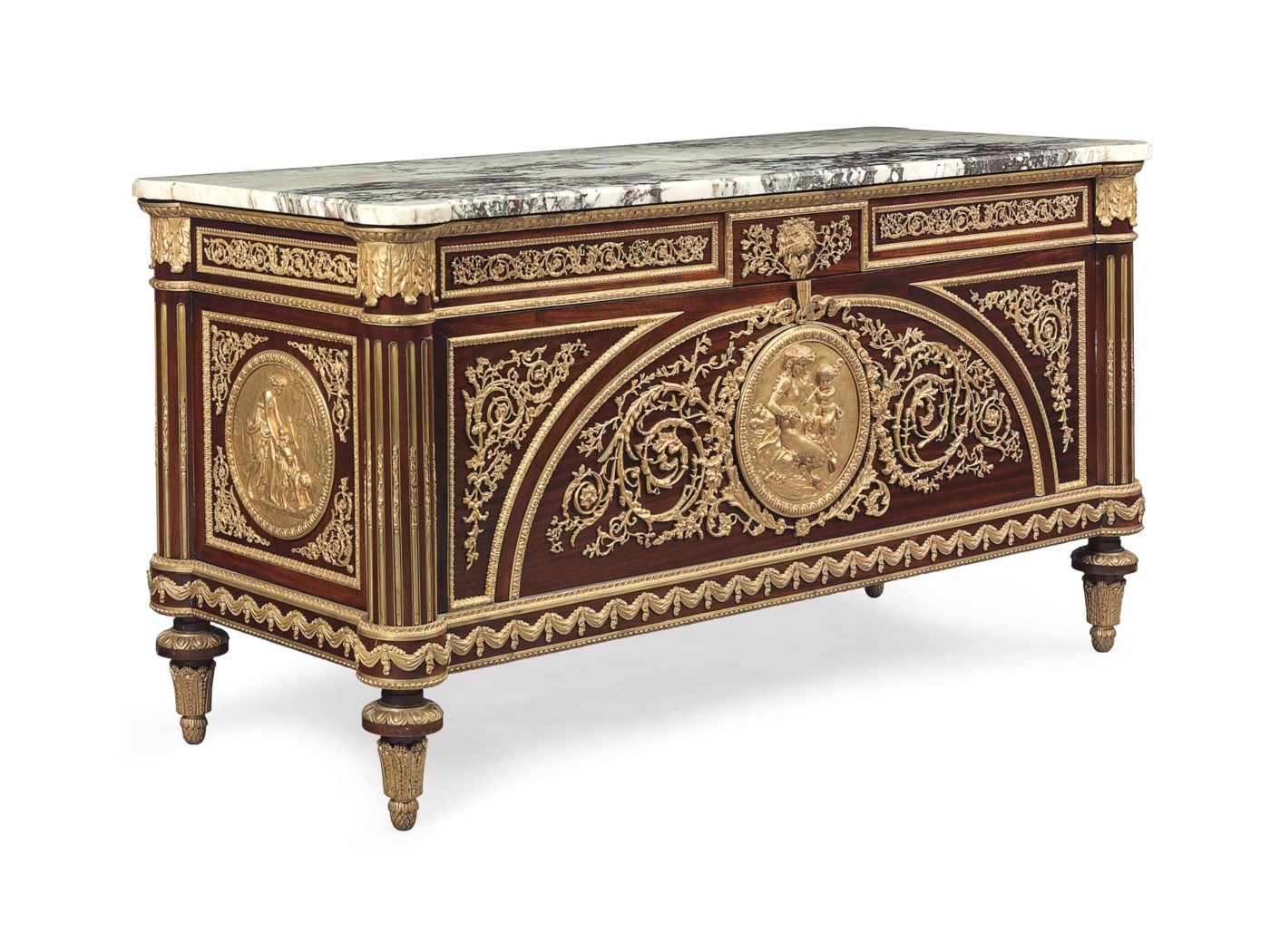 A FRENCH ORMOLU-MOUNTED MAHOGANY COMMODE , AFTER THE MODEL BY JOSEPH ...